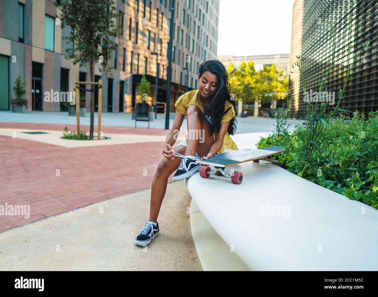 Beautiful young woman longboard sitting hi-res stock photography and ...