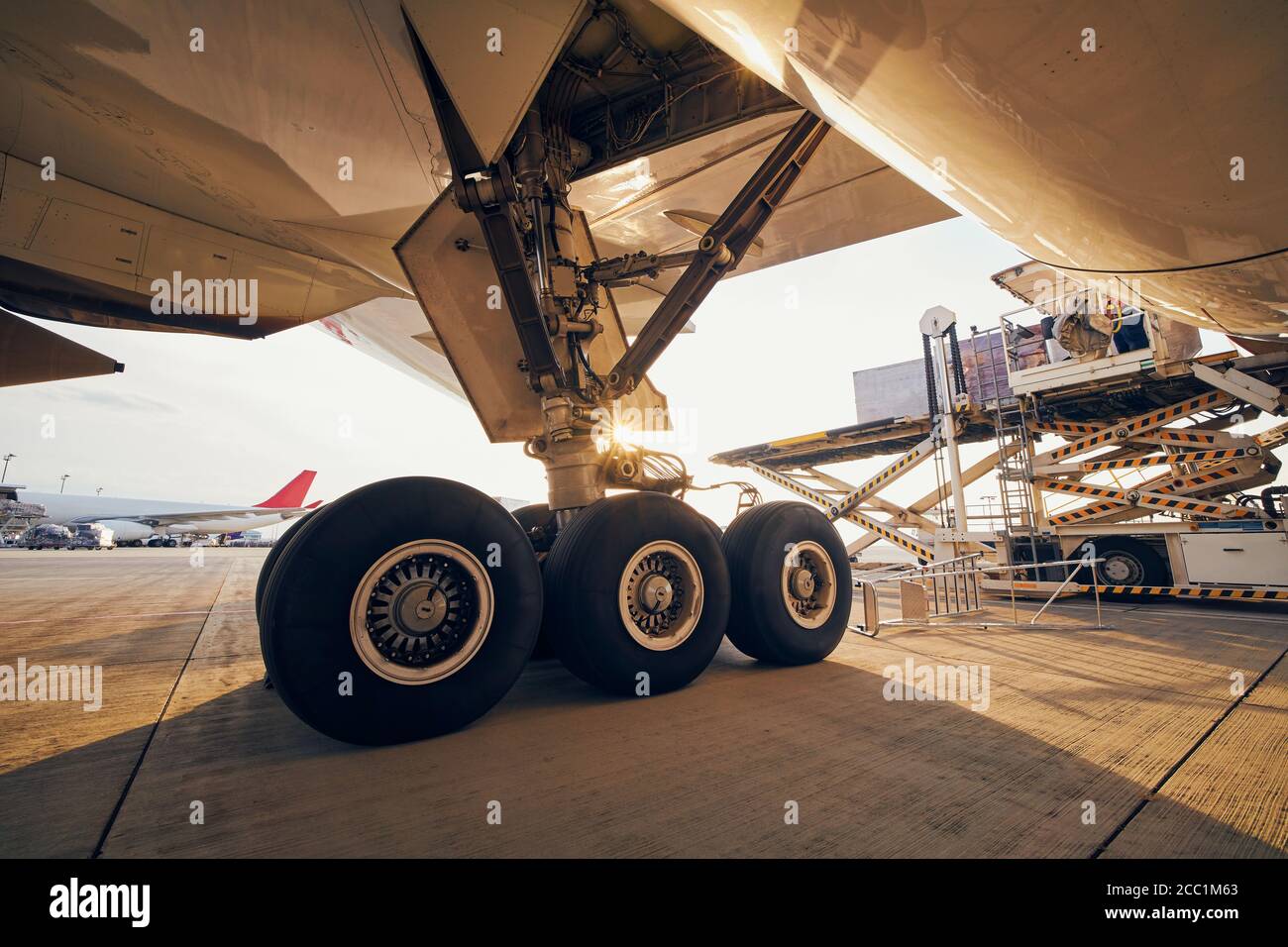 Preparation before flight. Loading of cargo containers to airplane at ...