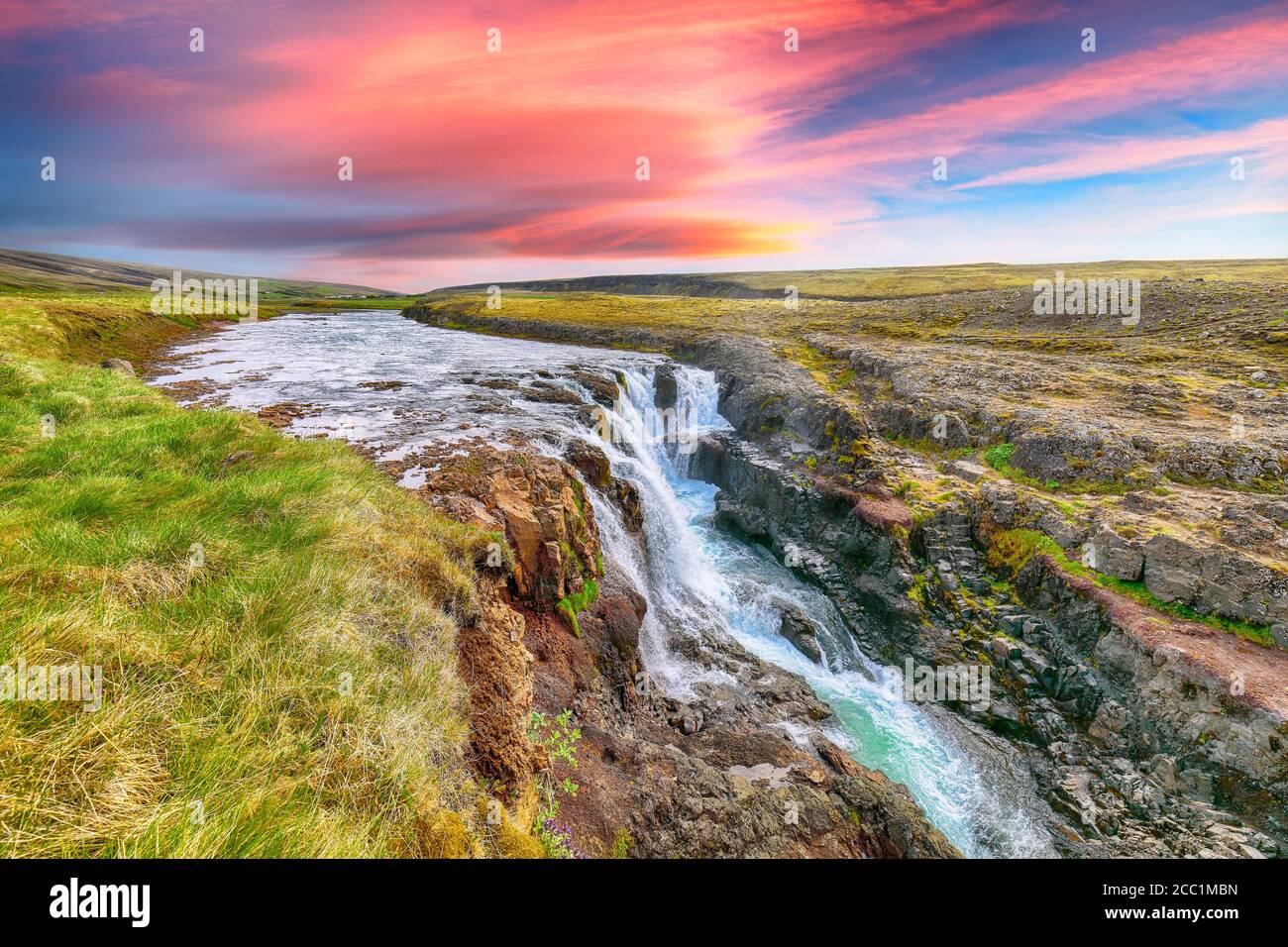 Breathtaking view of Kolufossar waterfall at sunset. Popular tourist ...