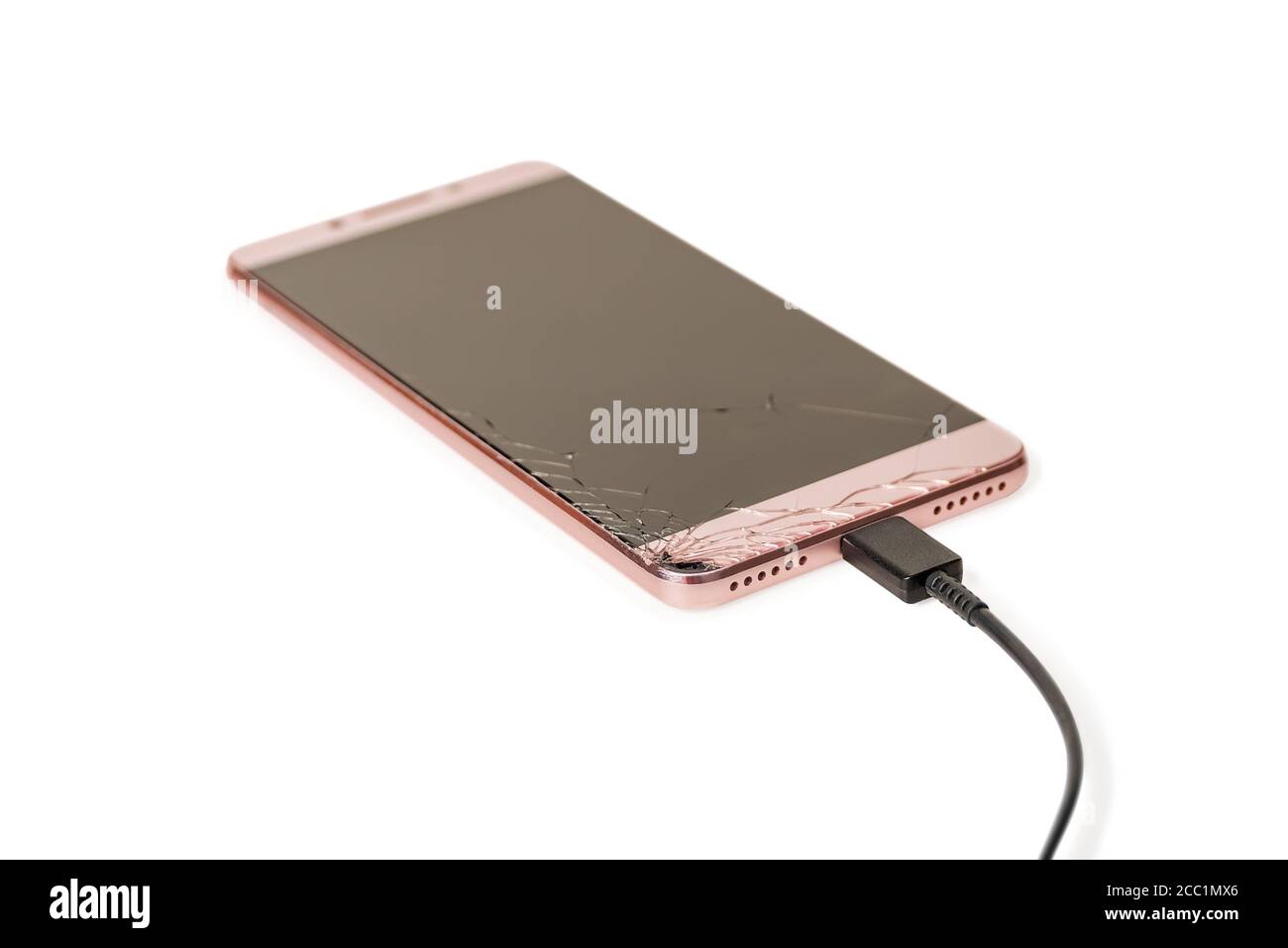 smartphone with broken screen charging via cable isolated on white ...