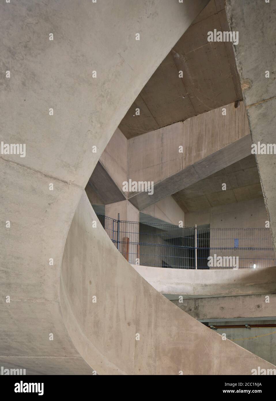 View up concrete spiral stair to tree column. The Marshall Building LSE ...