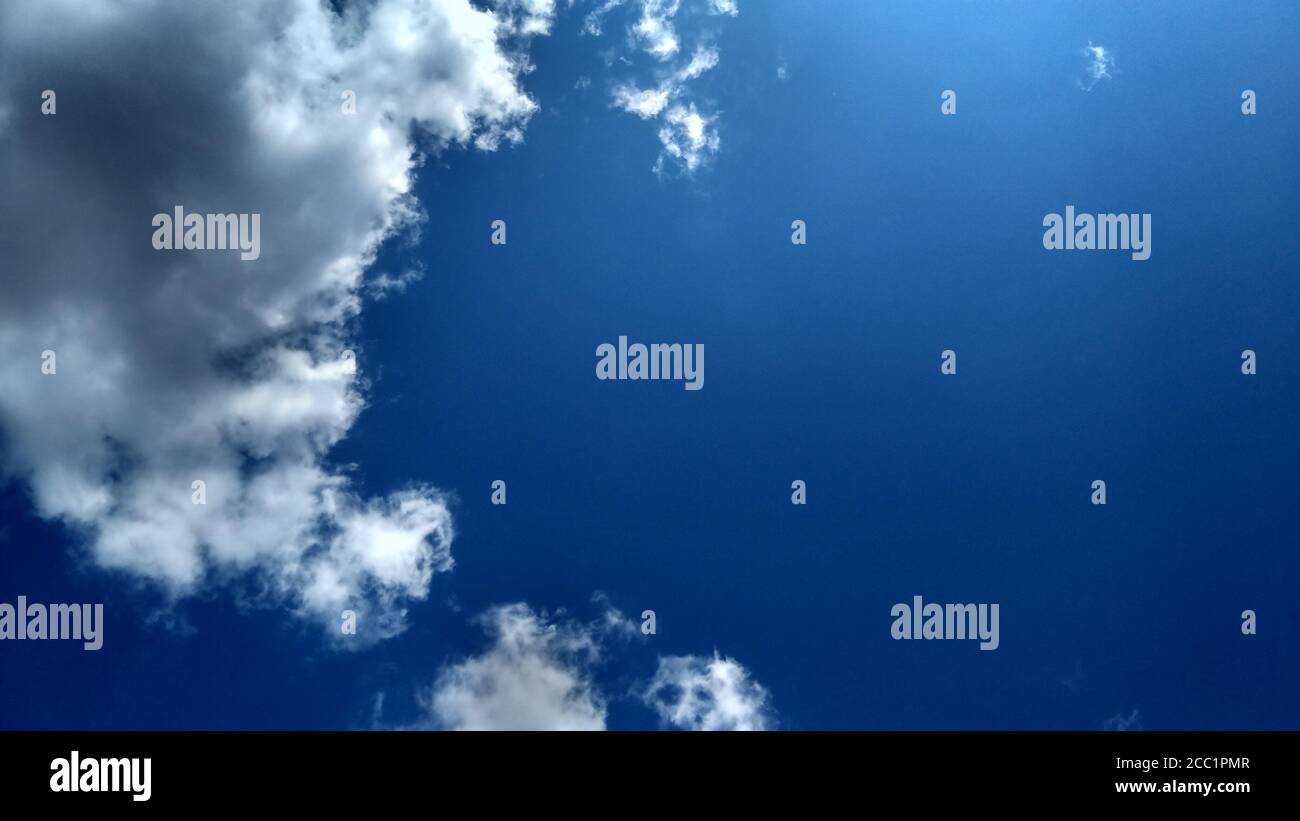 Blue sky with white clouds. Peaceful sky background. Space for text ...