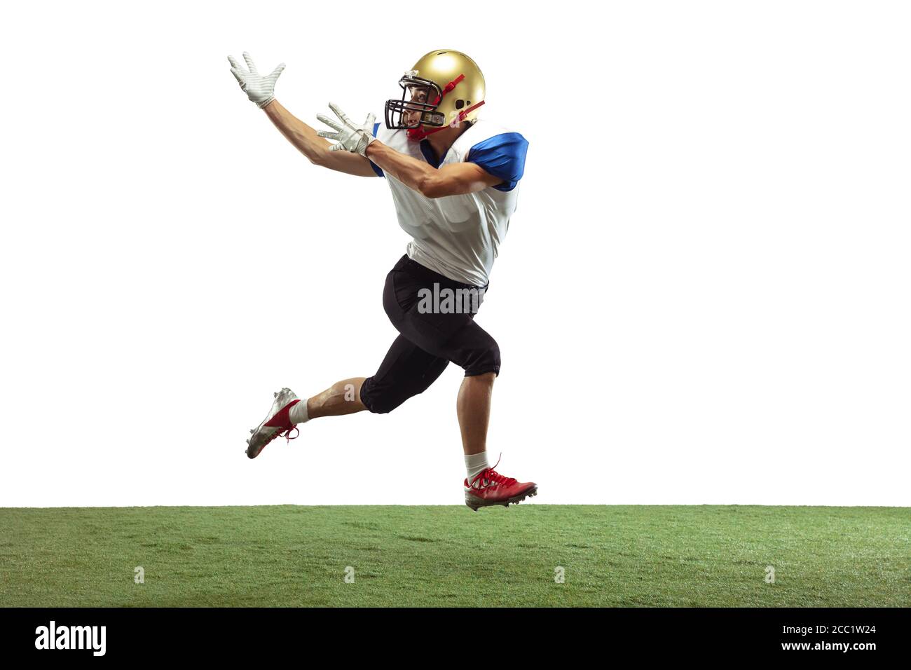 In jump, flight. American football player isolated on white studio ...
