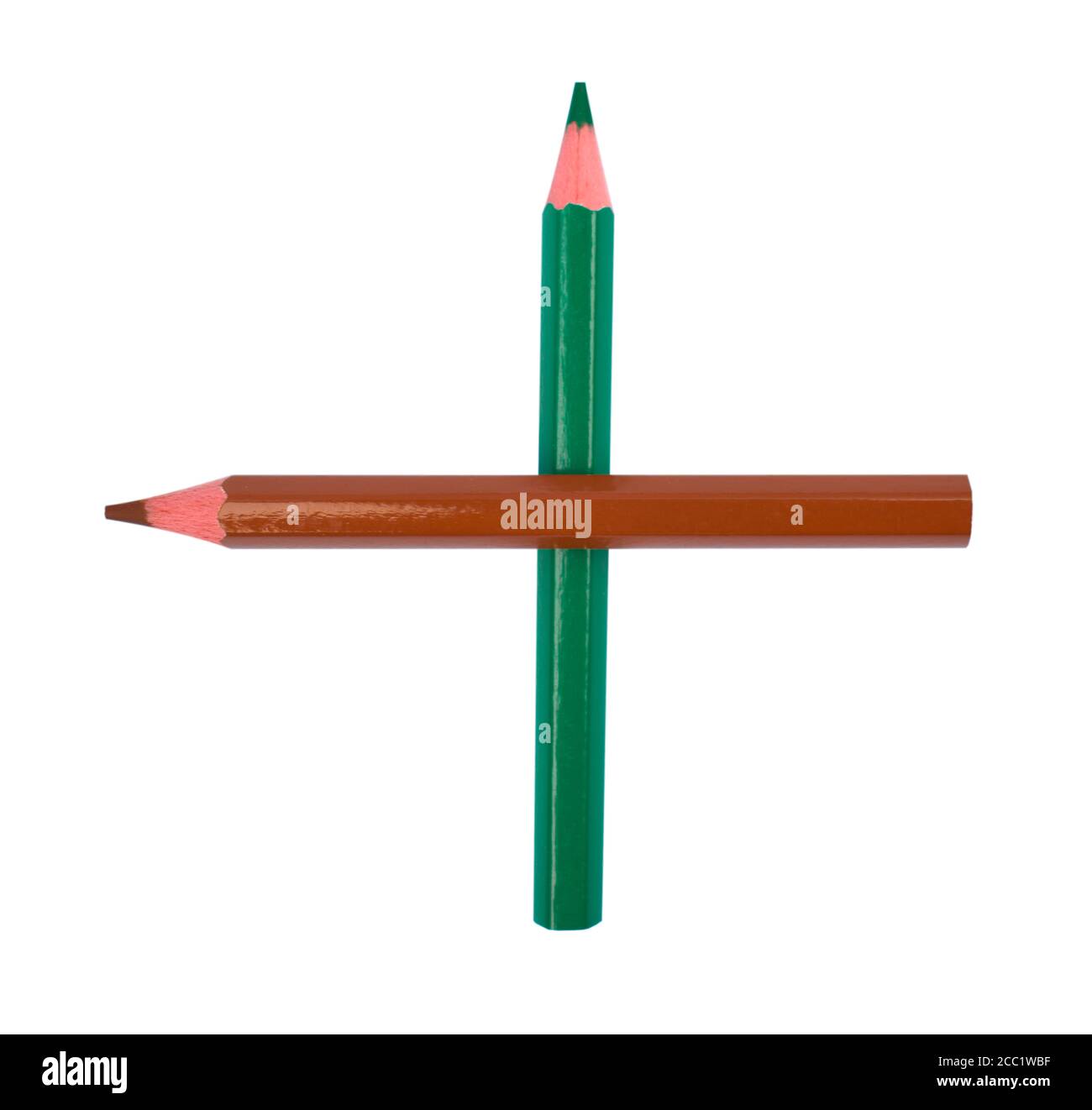 Plus symbol made with some different colored wood pencil crayons on ...