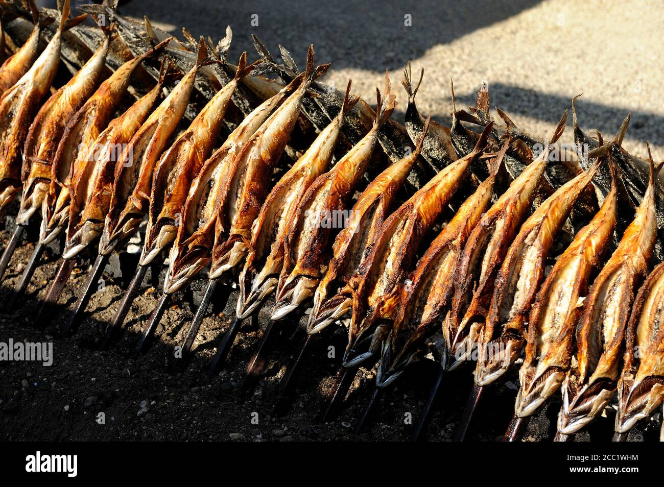 Germany, Bavaria, Munich, Grilled fish on sticks Stock Photo - Alamy