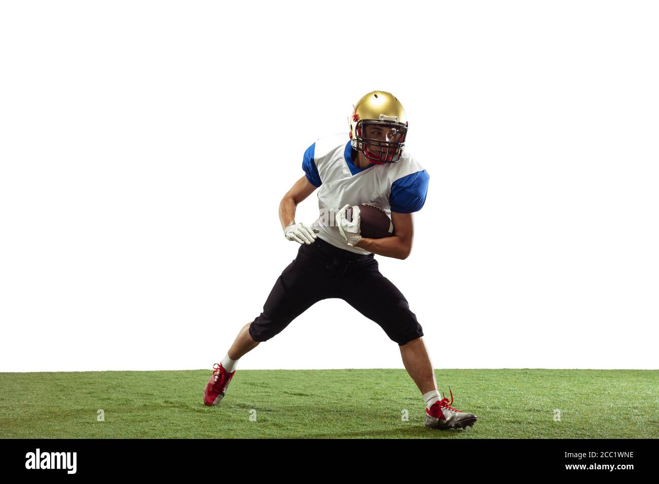 In action. American football player isolated on white studio background ...
