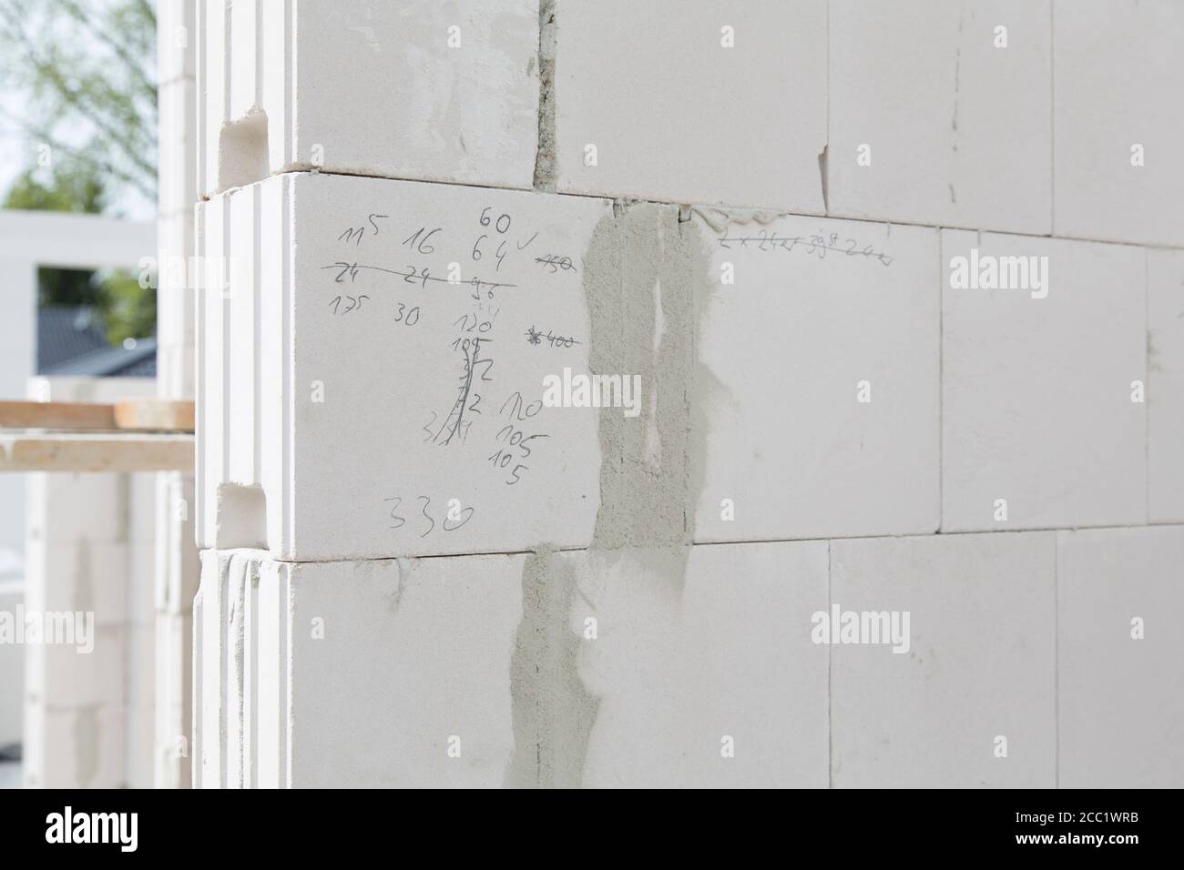 Germany, Brandenburg, Wall of gas concrete blocks at construction site ...