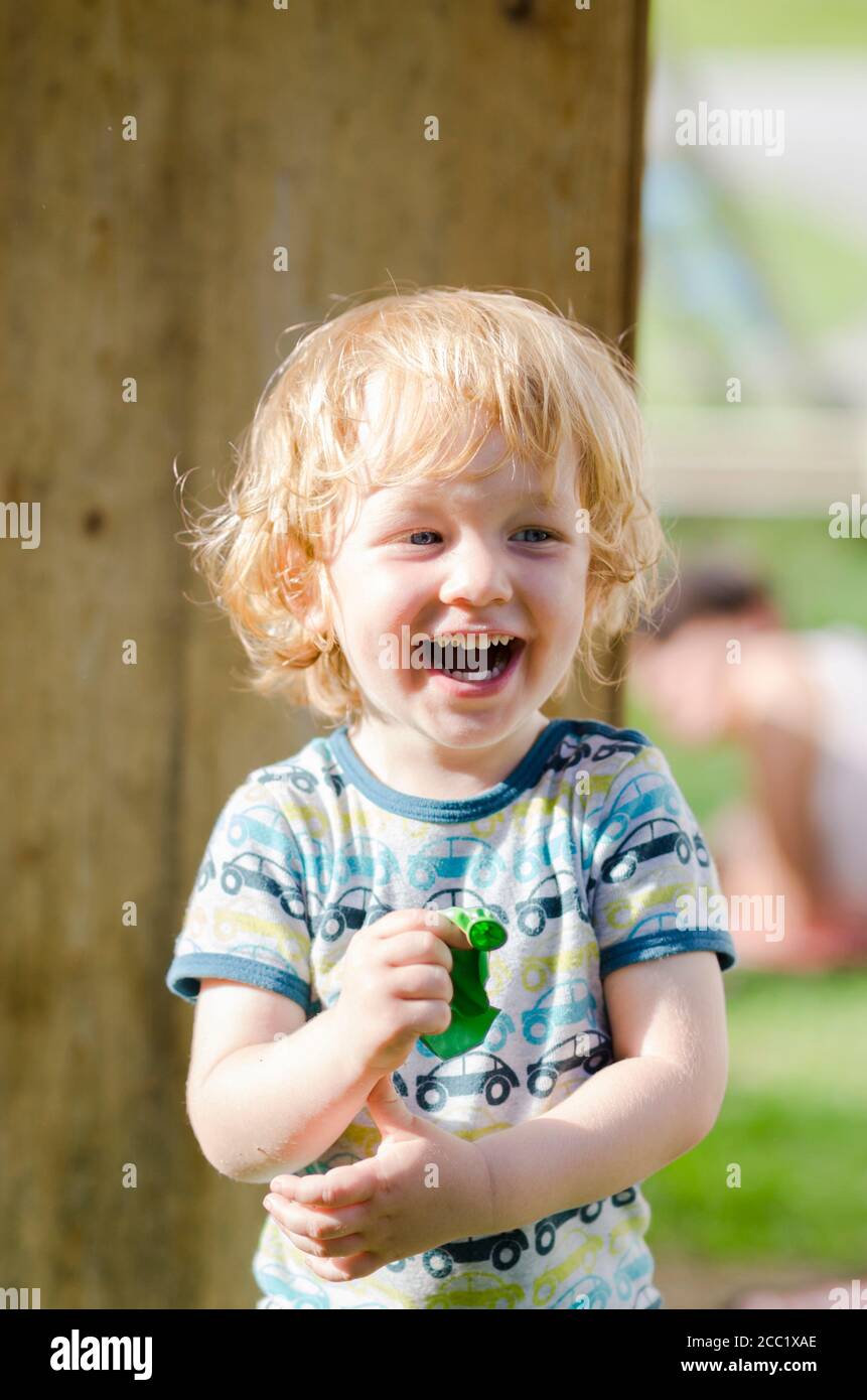 Cute boy laughing hi-res stock photography and images - Alamy