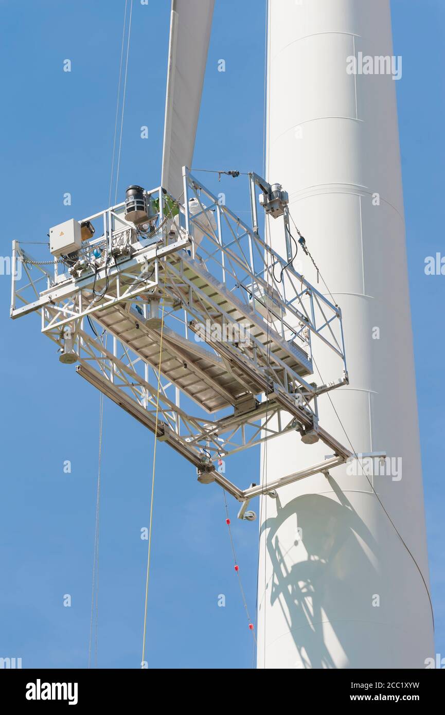 Maintenance lift of wind turbine against sky hi-res stock photography ...