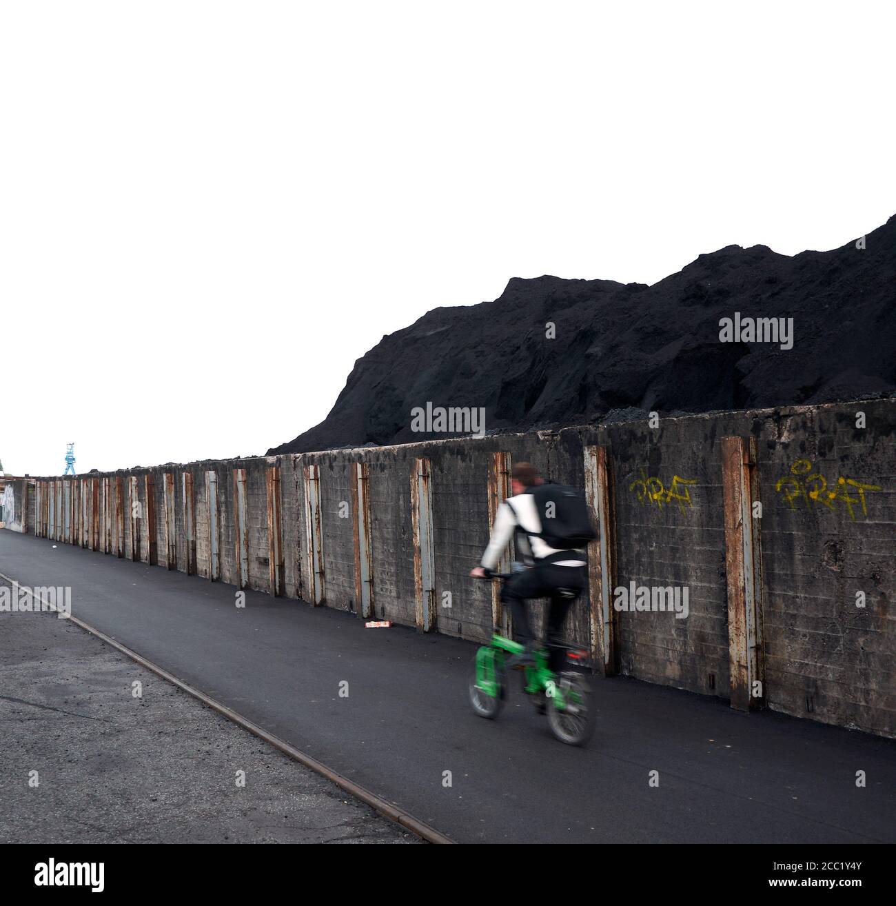 Cyclist passing concrete wall hi-res stock photography and images - Alamy