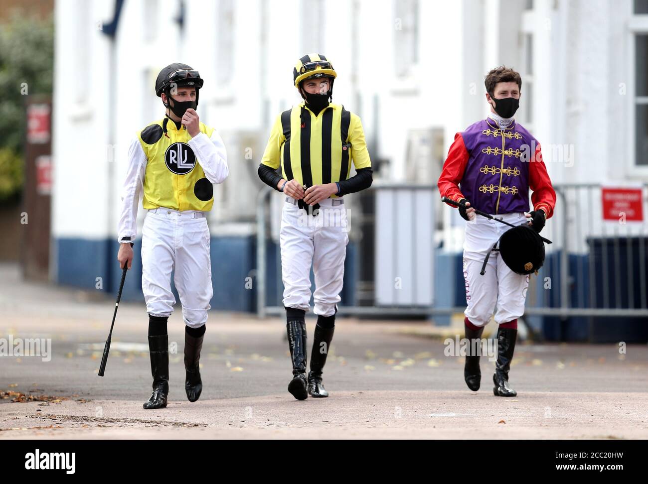 Oisin Murphy (right) and jockeys make their way out ahead of the ...