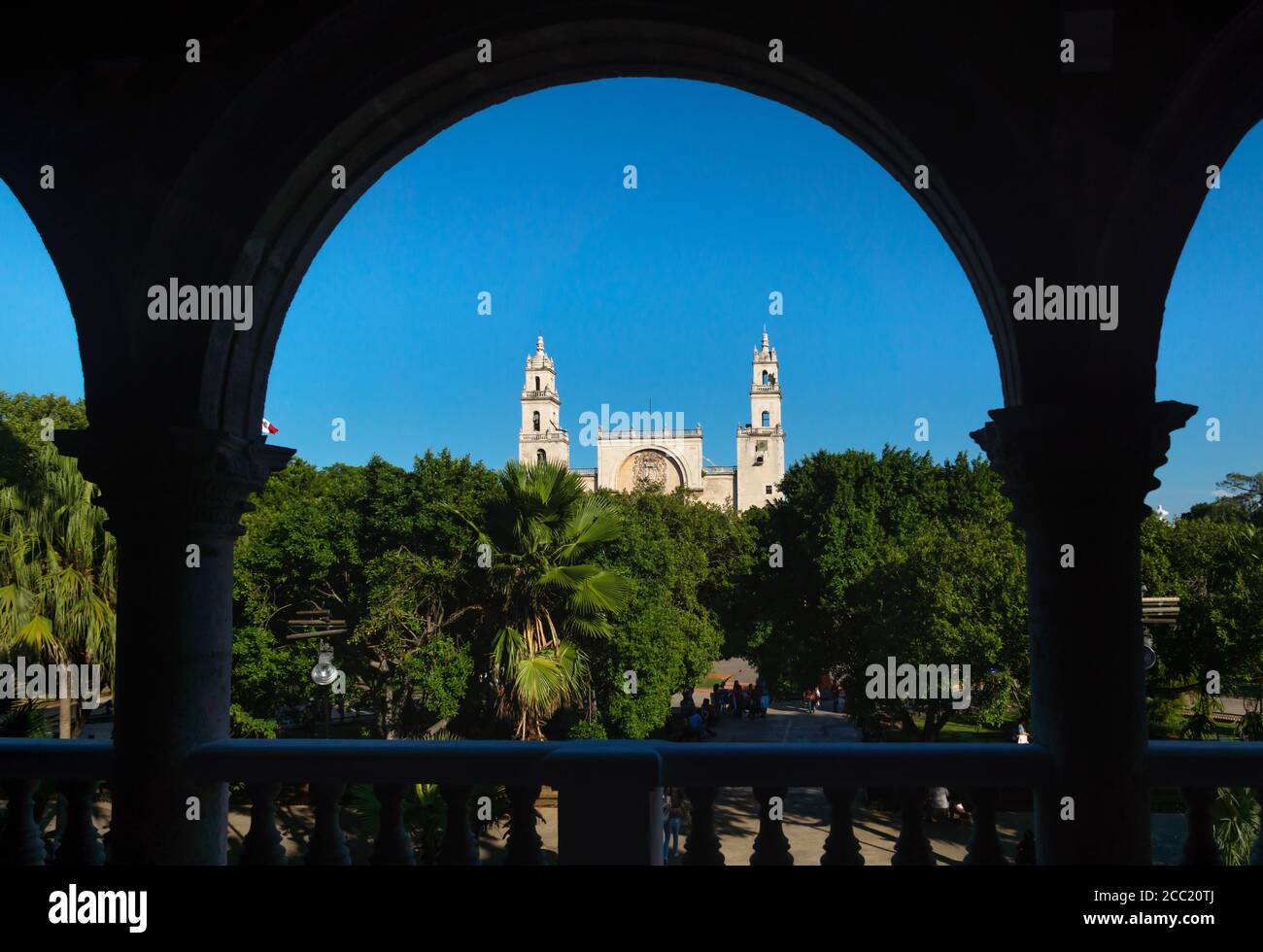 View through arches to the cathedral of Merida over the main square ...