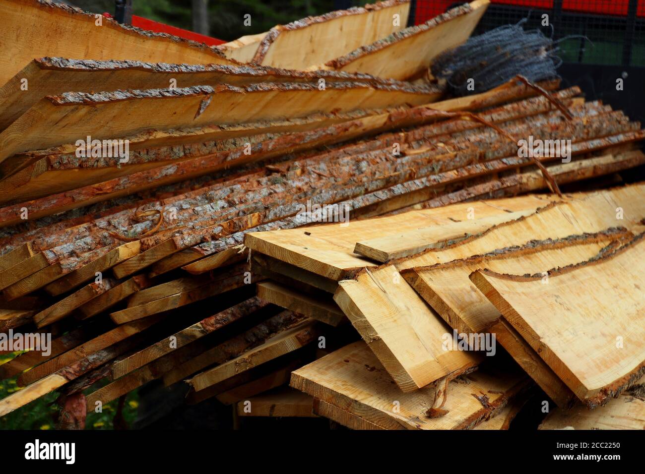Closeup of the pile of wooden logs stacked together on top each other ...