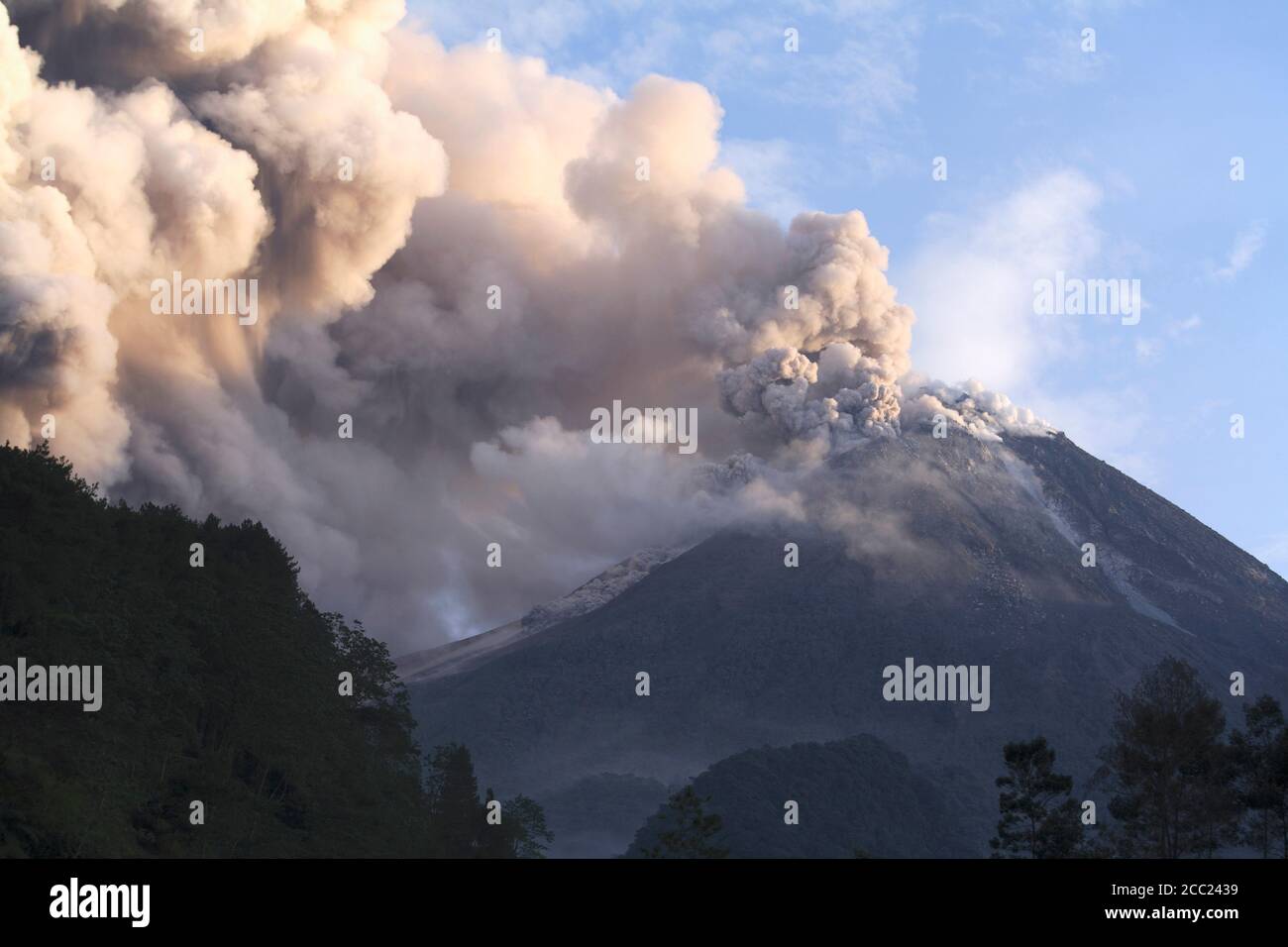 Indonesia, Smoke Rising from Volcano Stock Photo - Alamy