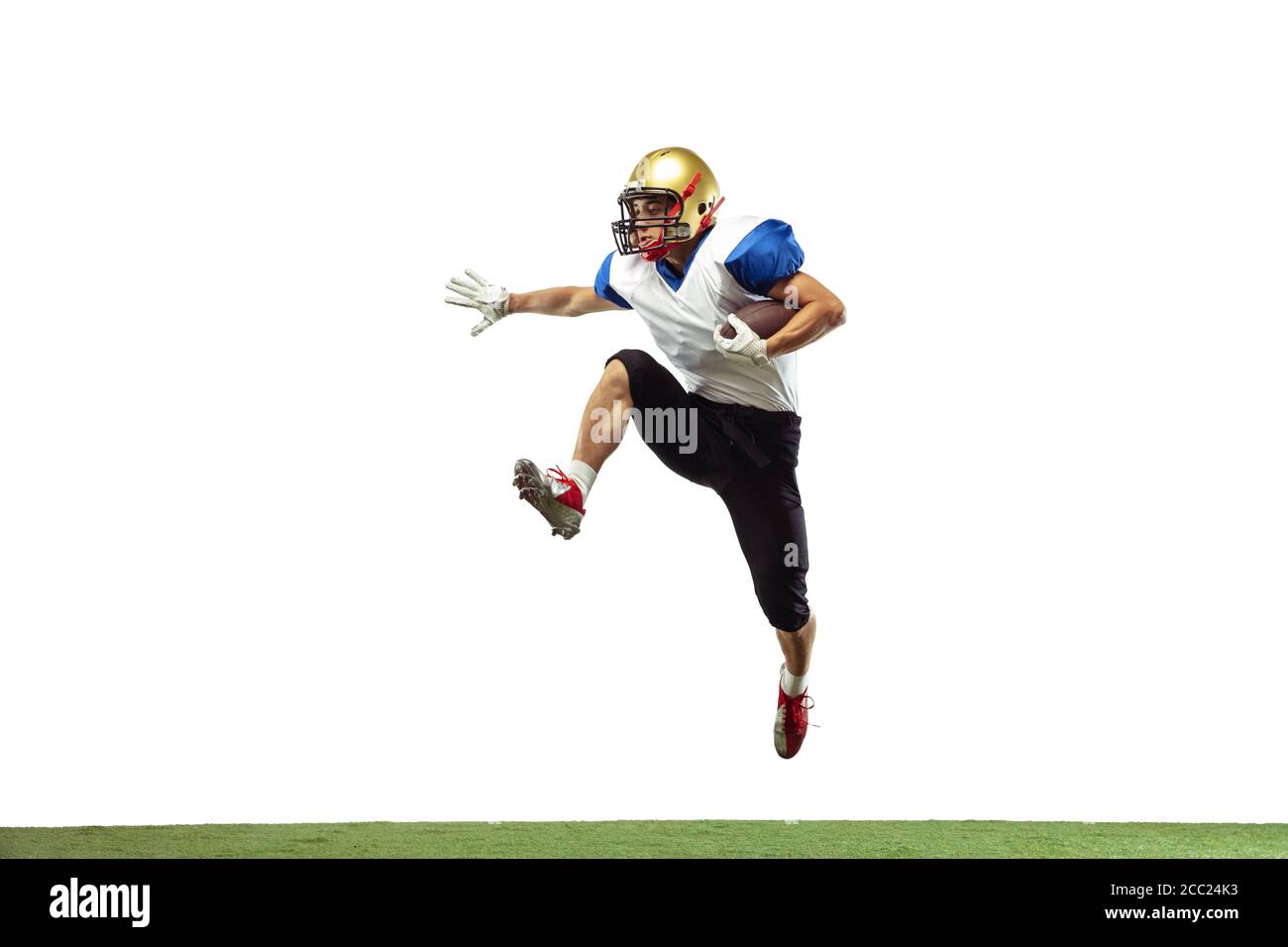 In jump, flight. American football player isolated on white studio ...