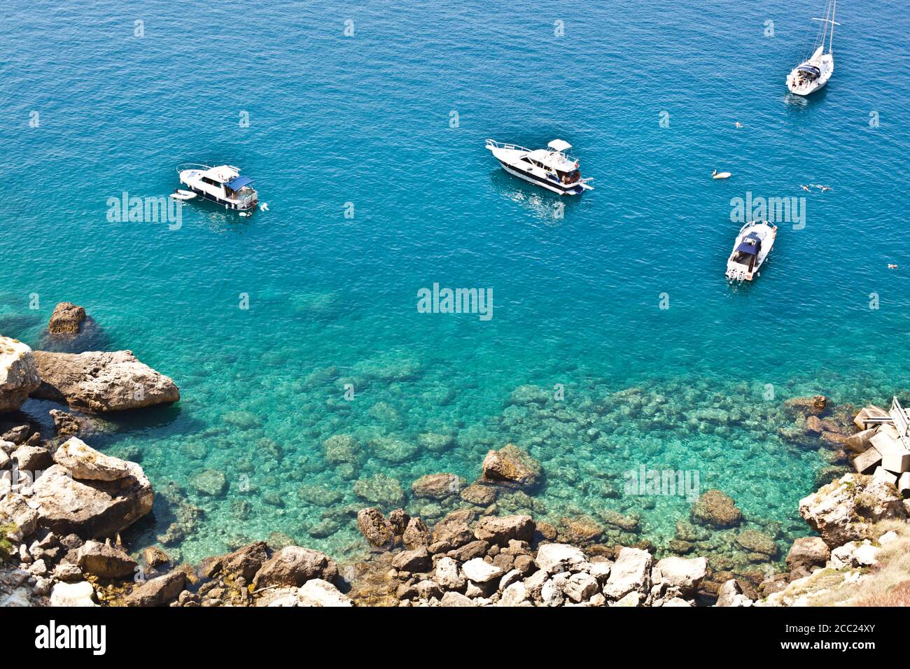 View of the Tremiti Islands. Boats near a rock stone coast. San Domino ...