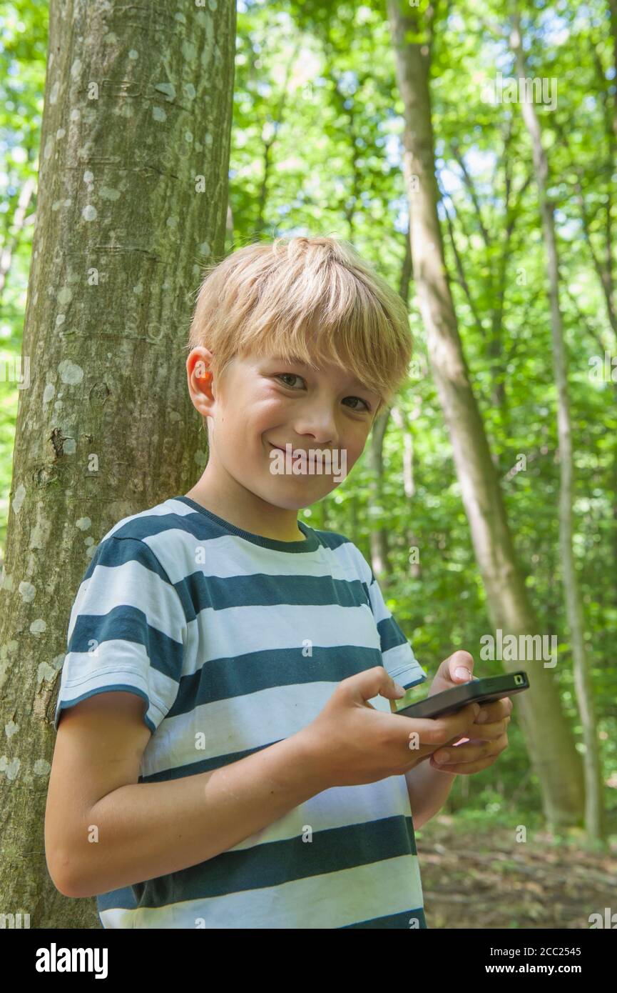 Boy playing with camera phone hi-res stock photography and images - Alamy