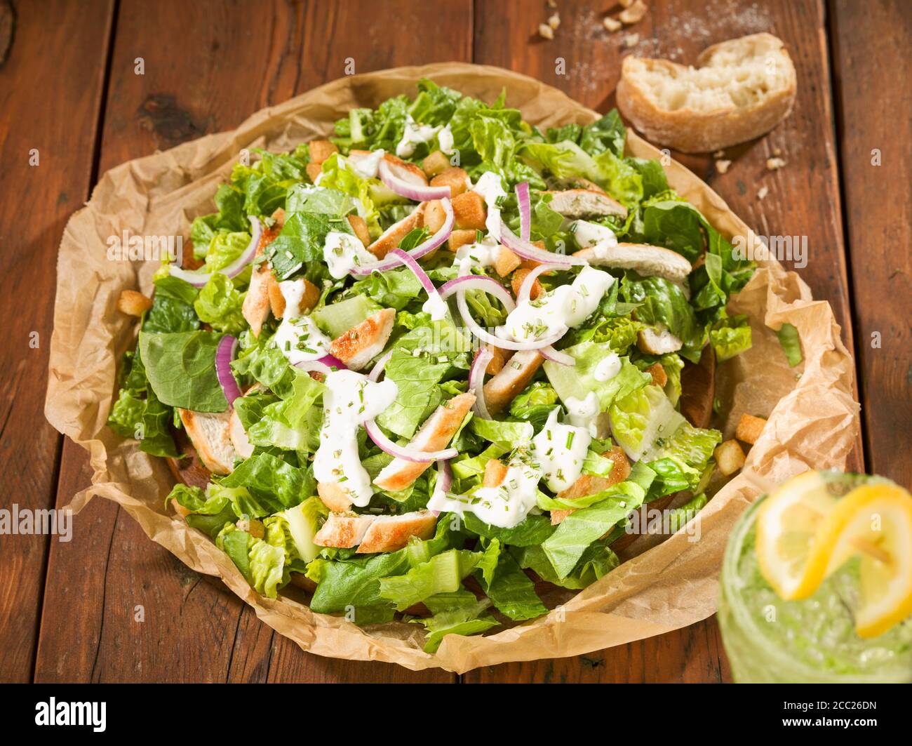 Caesar salad with cool drink, close up Stock Photo - Alamy