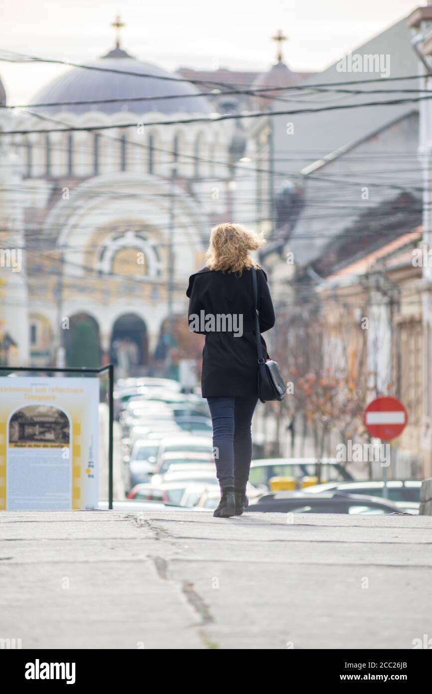 Woman walking on the street. Real people Stock Photo - Alamy