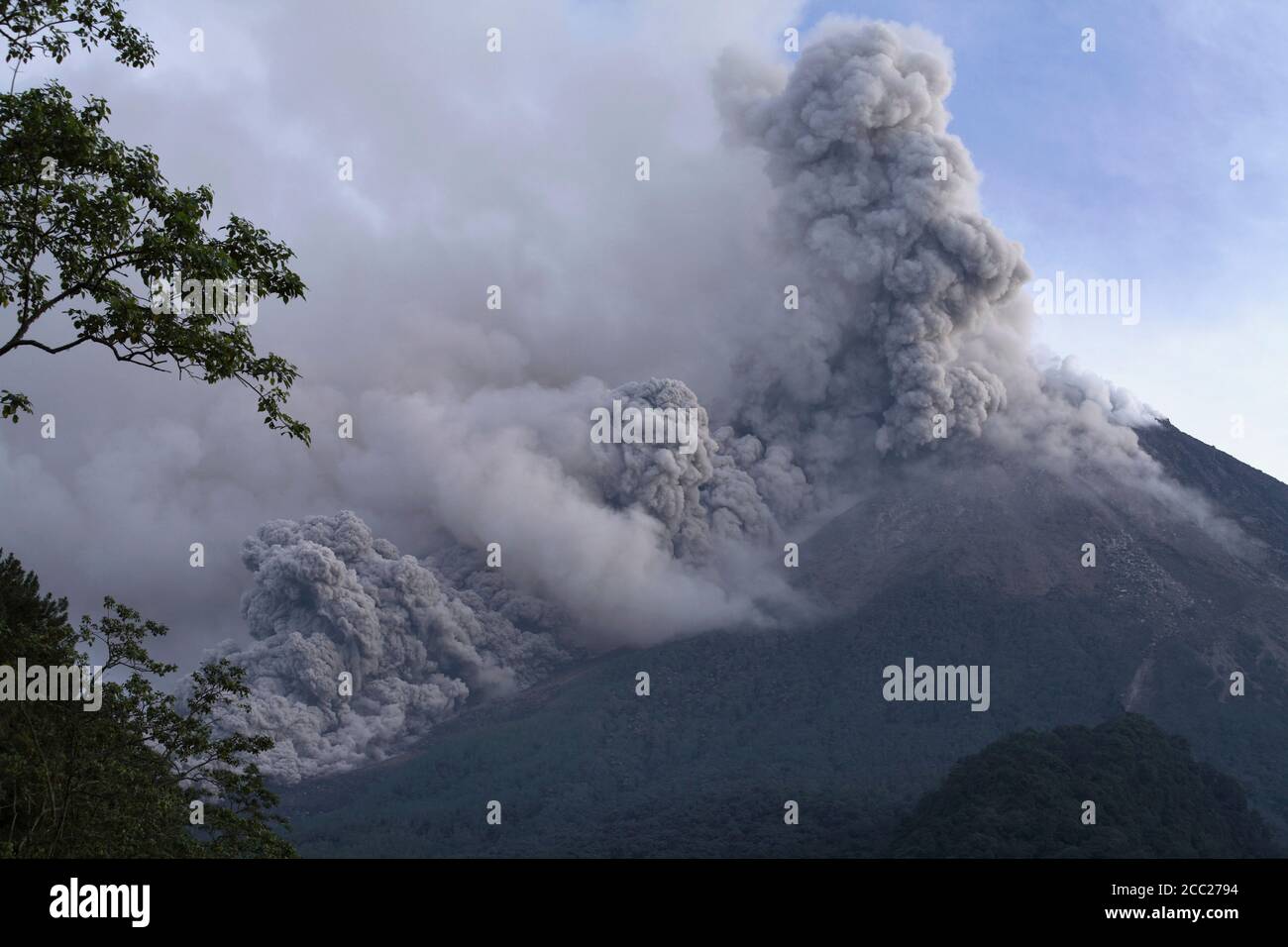 Indonesia, Smoke Rising from Volcano Stock Photo - Alamy