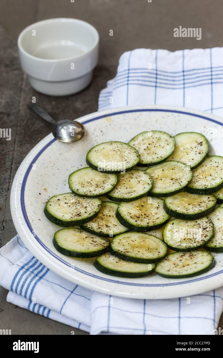 Plate of sliced marinated courgette hi-res stock photography and images ...