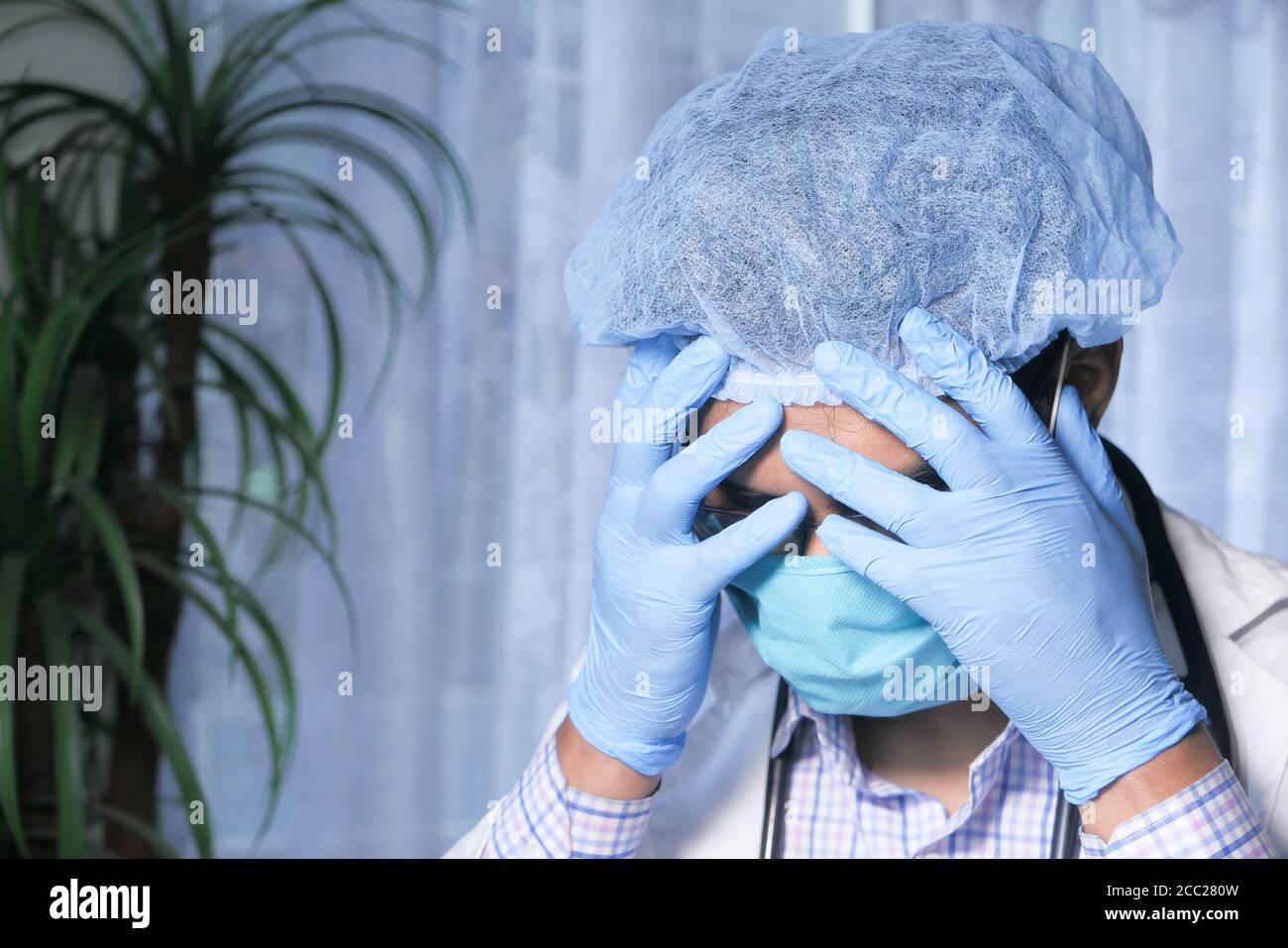 Sad matured doctor covering hi-res stock photography and images - Alamy
