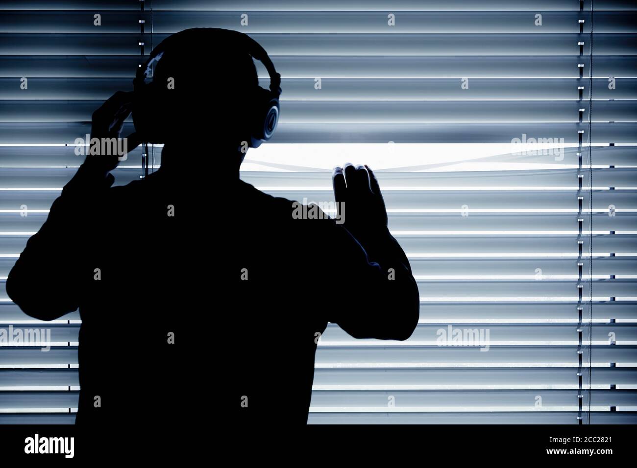 Silhouette man headphones listening music hi-res stock photography and ...