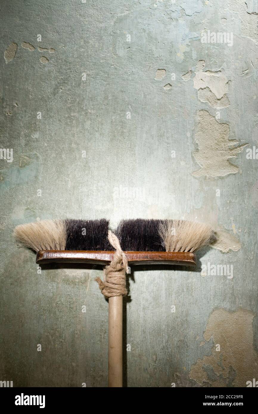 Broom leaning up against wall hi-res stock photography and images - Alamy