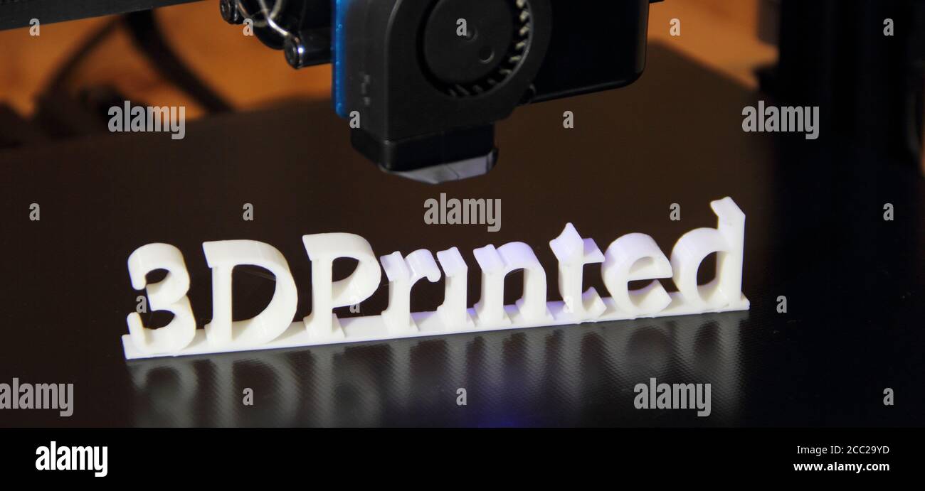 a 3D printer printing the text "3d printed Stock Photo - Alamy