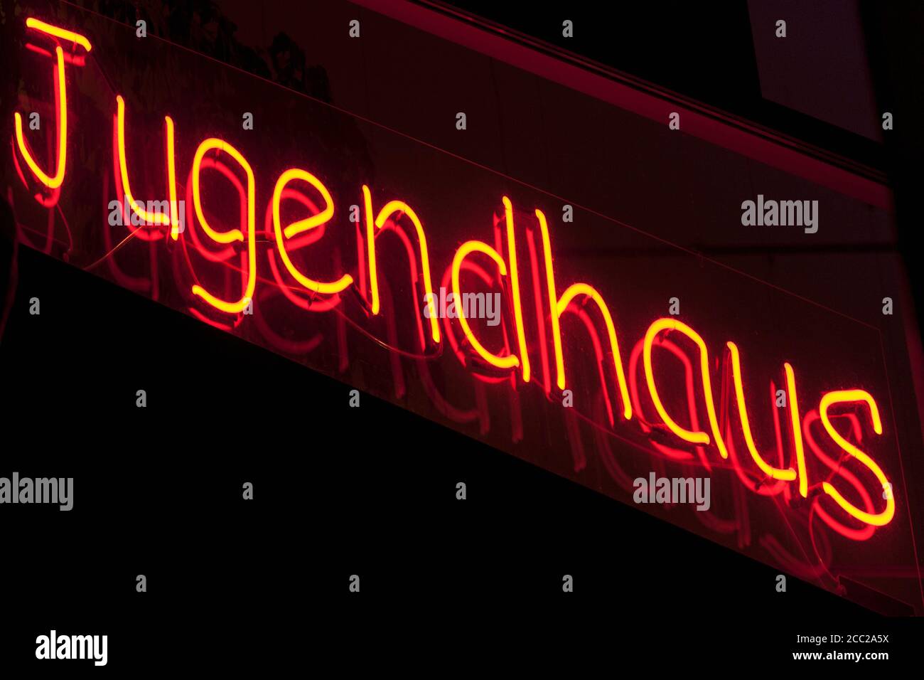 Germany, View of neon sign at a youth club, close up Stock Photo - Alamy