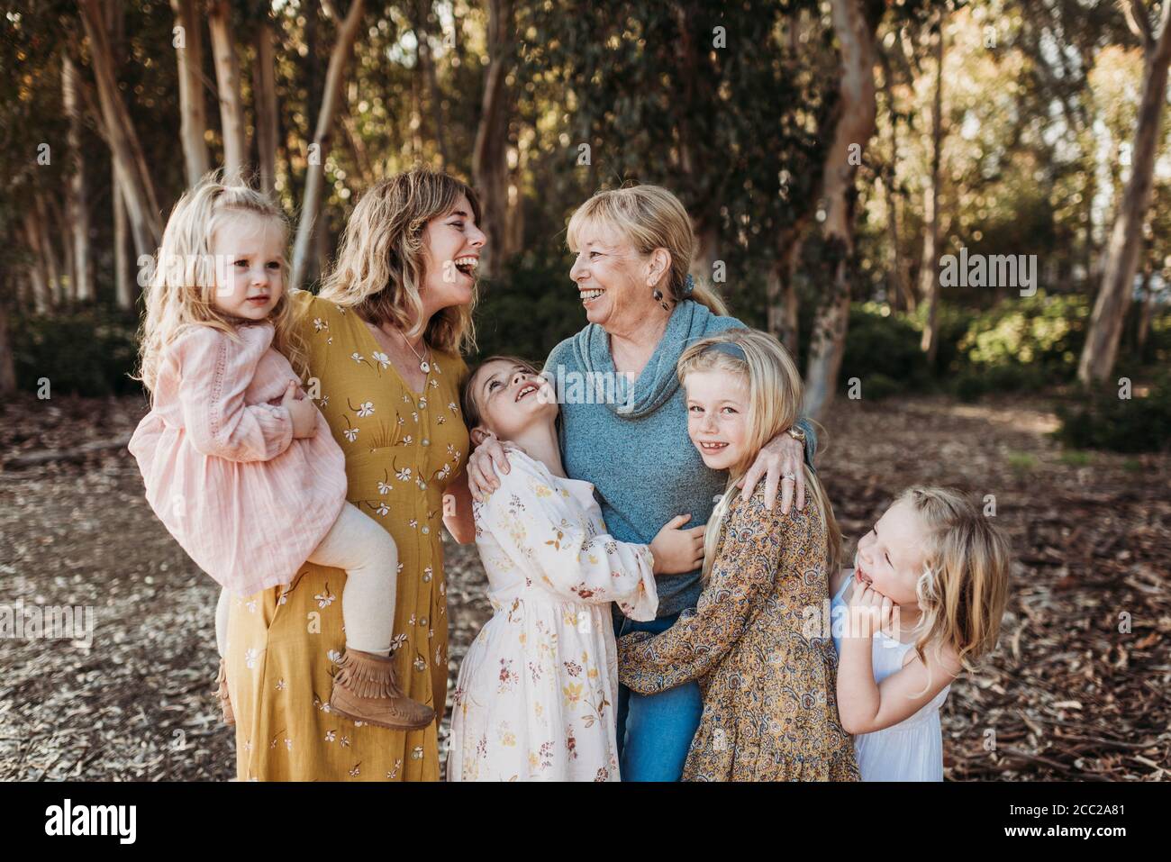 Portrait of Multigenerational Family of Women Embracing outside Stock ...