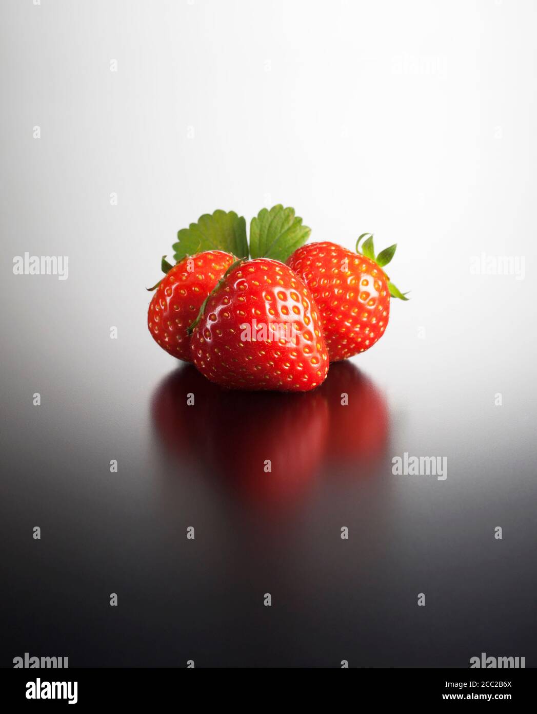 Strawberry on gray background hi-res stock photography and images - Alamy