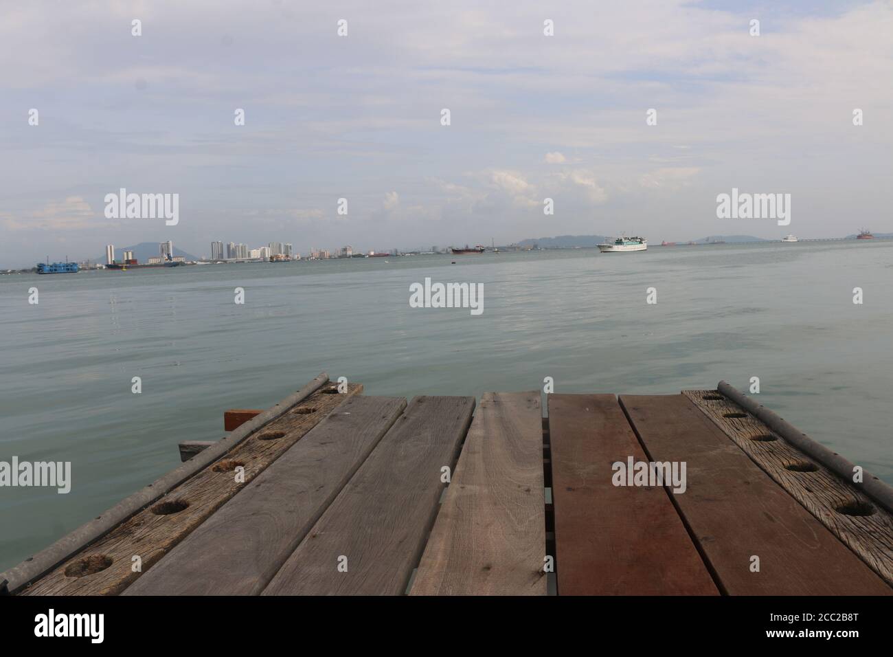 Beautiful wide shot of the sea from a pier in Penang Island, Malaysia ...