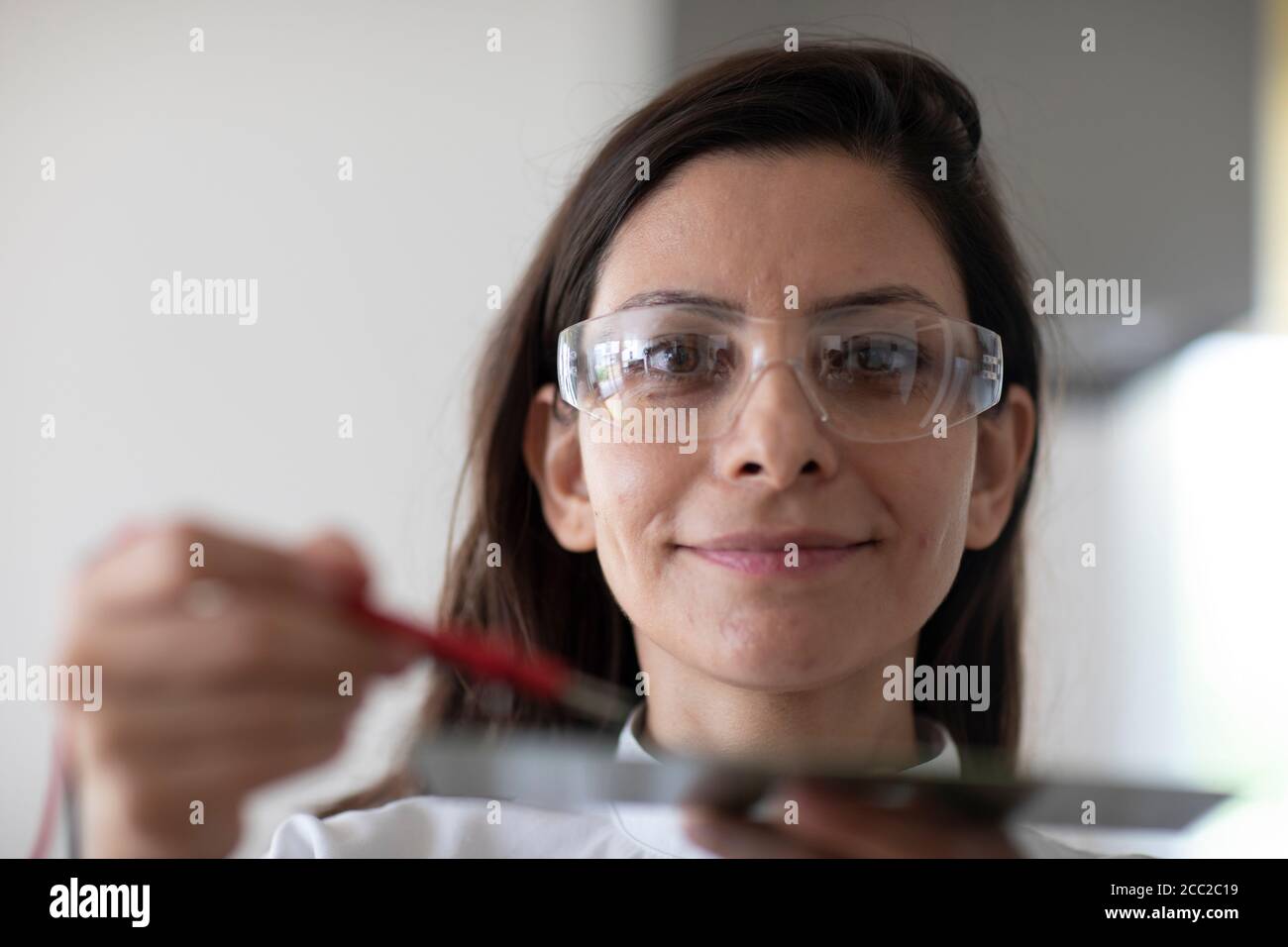Brown female scientist hi-res stock photography and images - Alamy