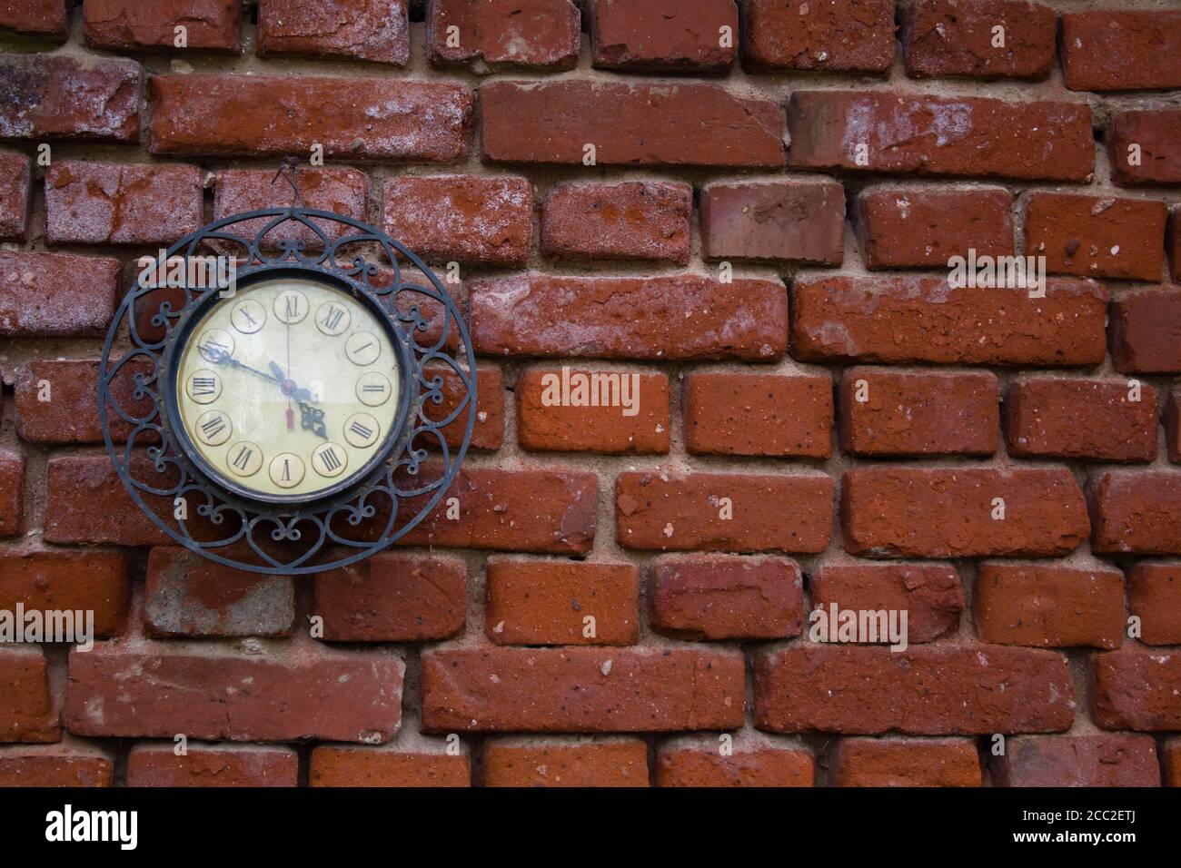Brick wall with clock hi-res stock photography and images - Alamy