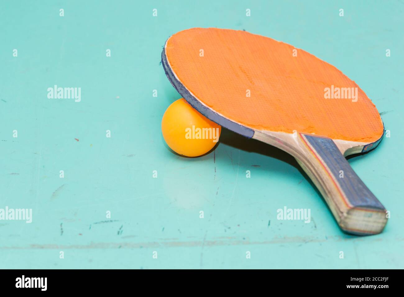 Old table tennis rackets on the game table Stock Photo - Alamy