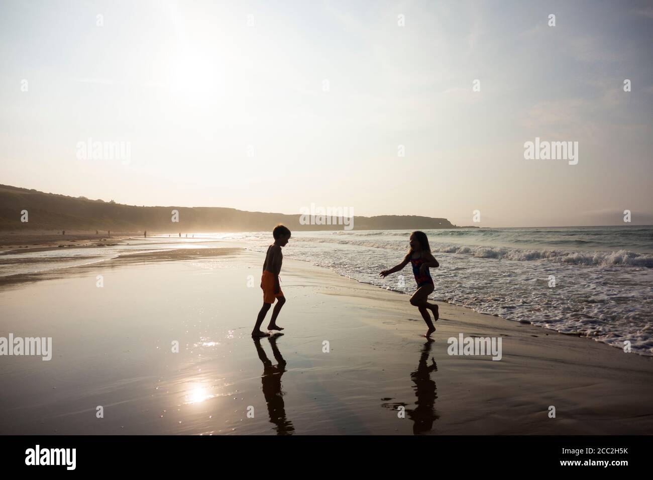 Children Playing In The Surf High Resolution Stock Photography and ...