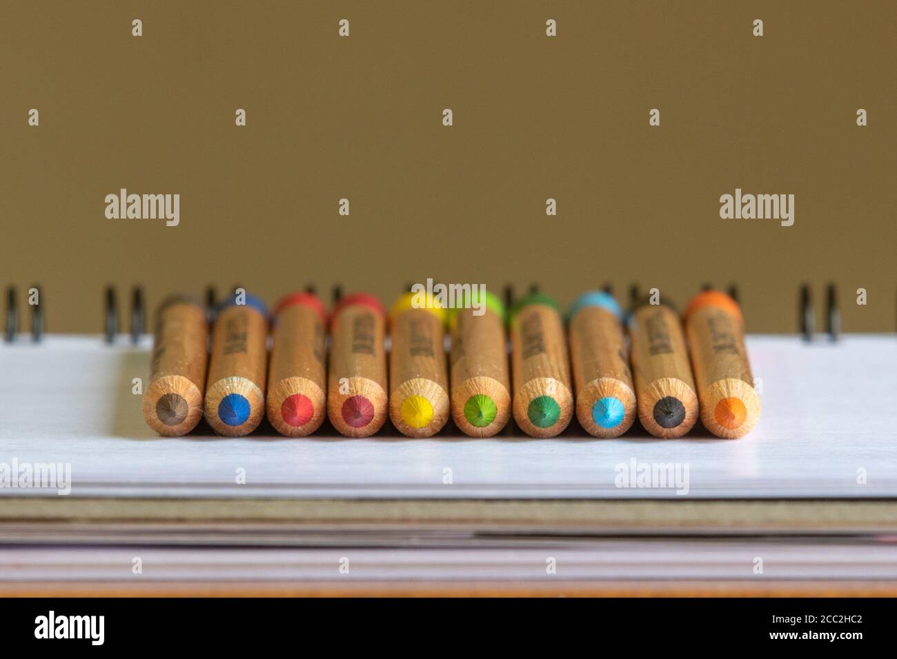 Closeup of beautiful colorful pencils stacked in a row Stock Photo - Alamy