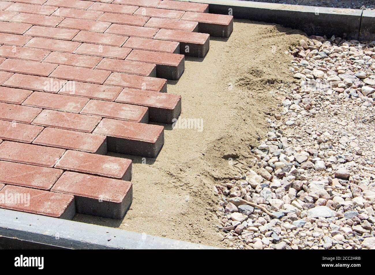 Process of construction of brick paved sidewalk, half built pavement ...
