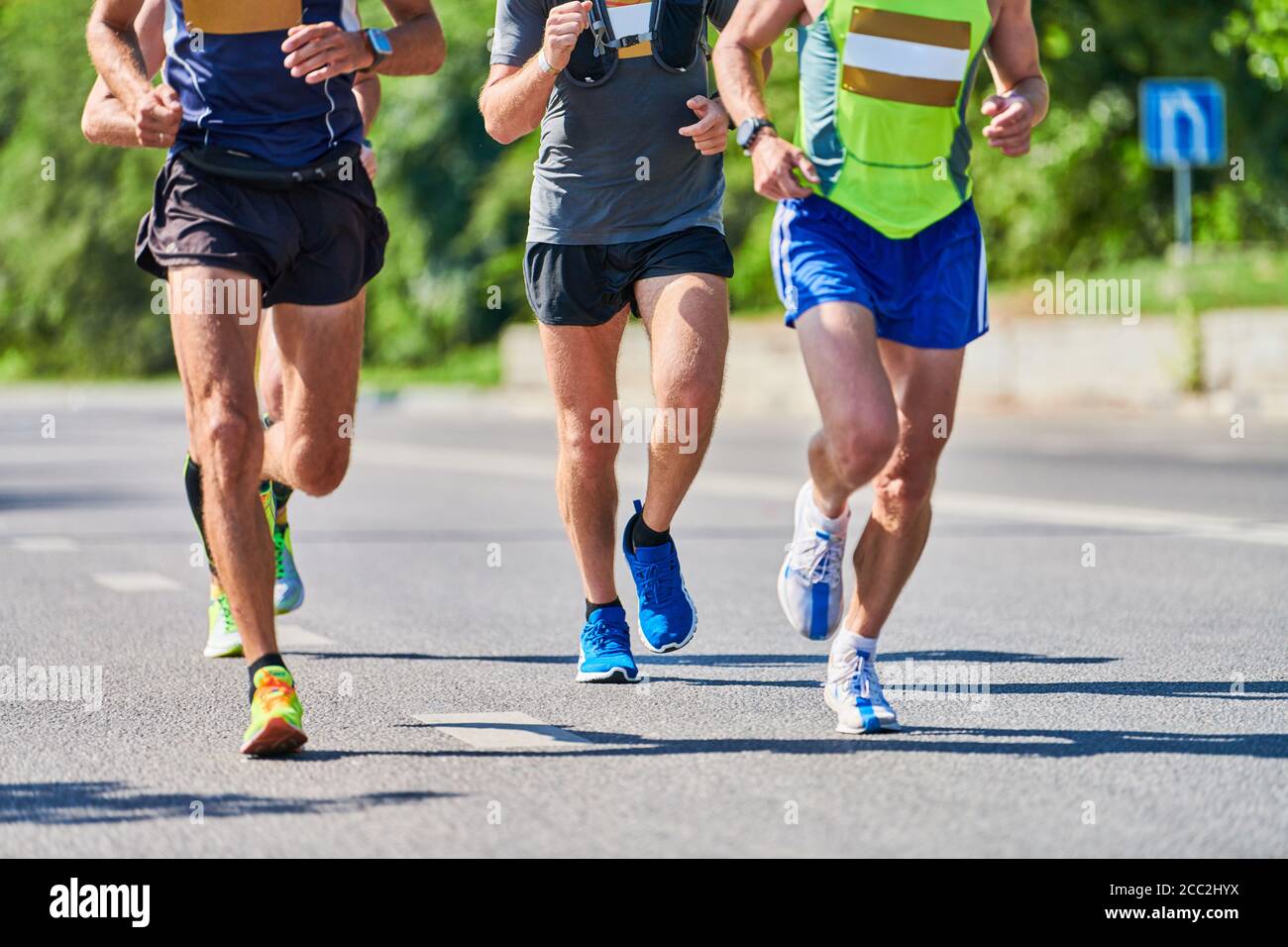 Running men. Sport men jogging in sportswear on city road. Healthy ...