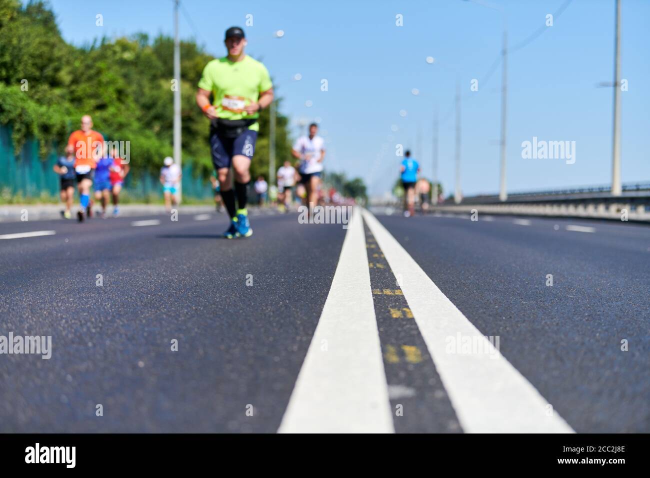 Marathon runners on city road. Running competition, copy space. Street ...
