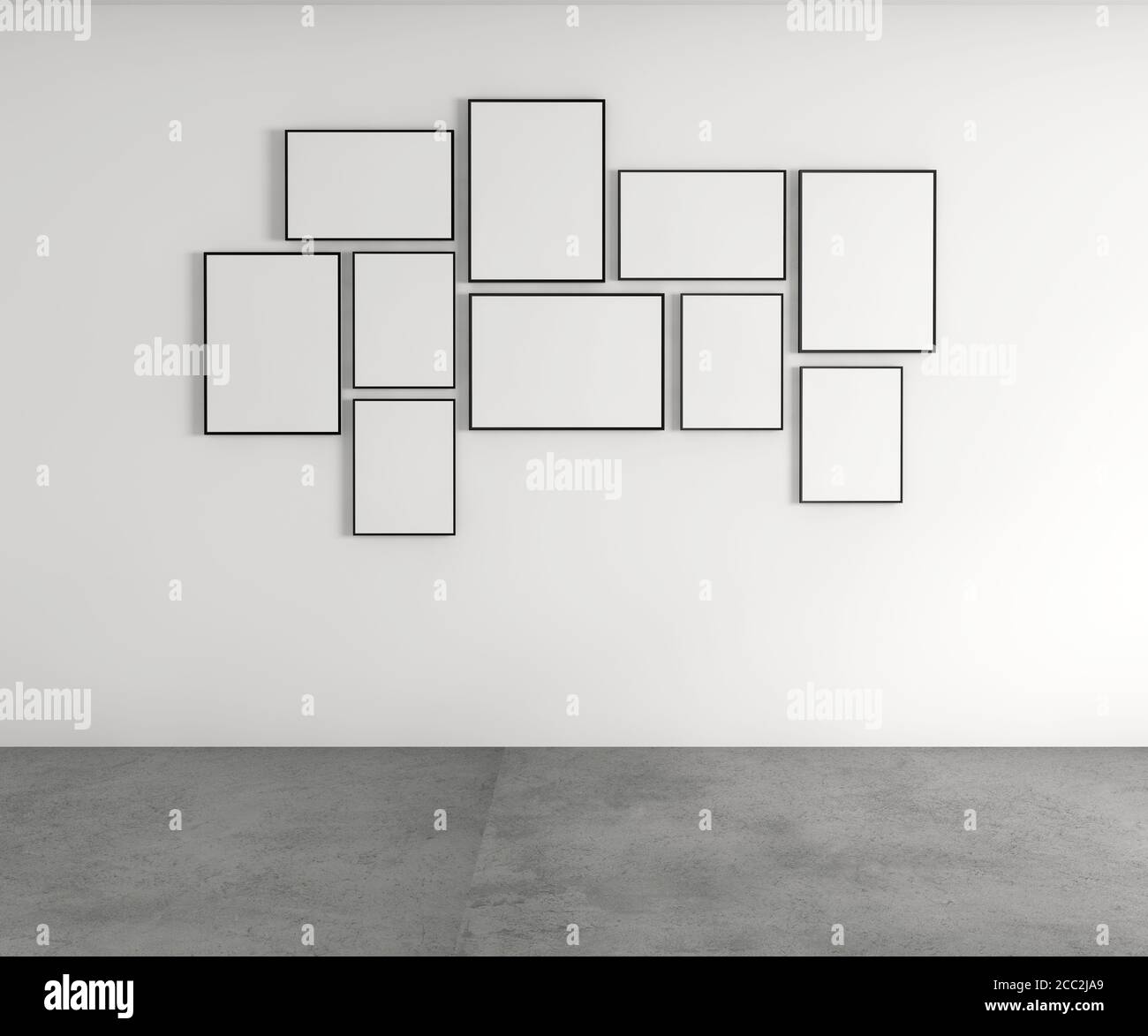Empty wall with blank picture frames Stock Photo - Alamy
