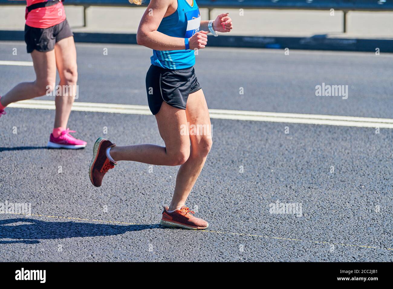 Running women. Sport women jogging in sportswear on city road. Healthy ...