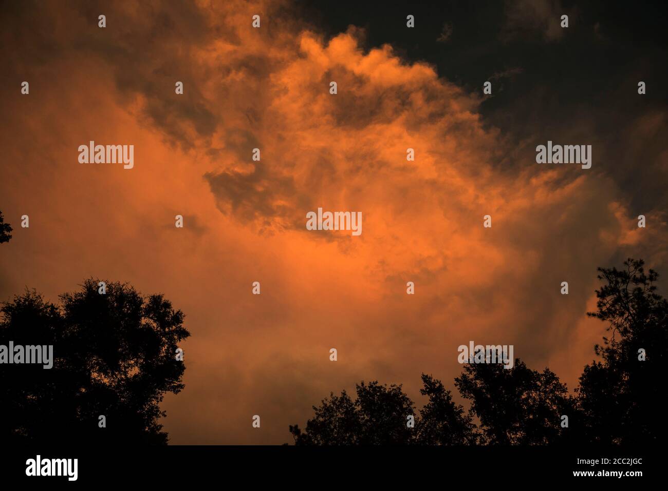 Yellow sky and clouds after late afternoon rainstorm Stock Photo - Alamy