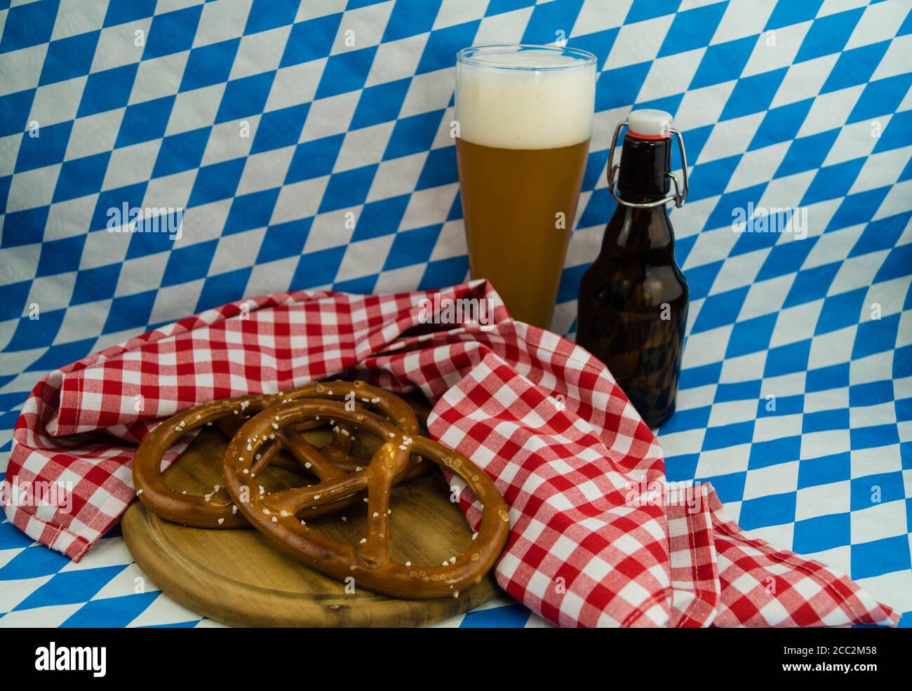 a bottle of beer and salty lye roll Stock Photo - Alamy