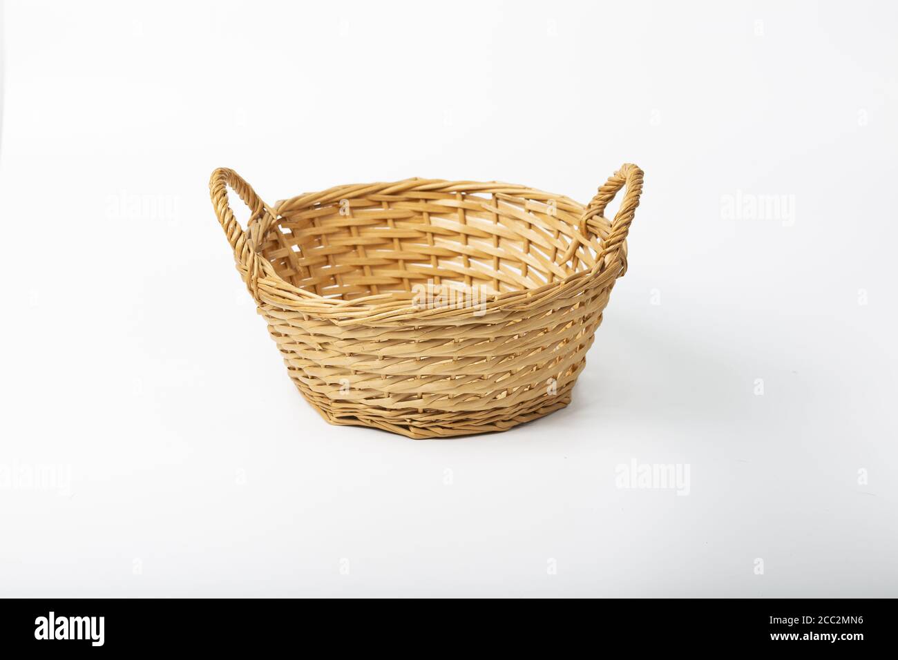 Empty wooden fruit or bread basket on white background Stock Photo - Alamy