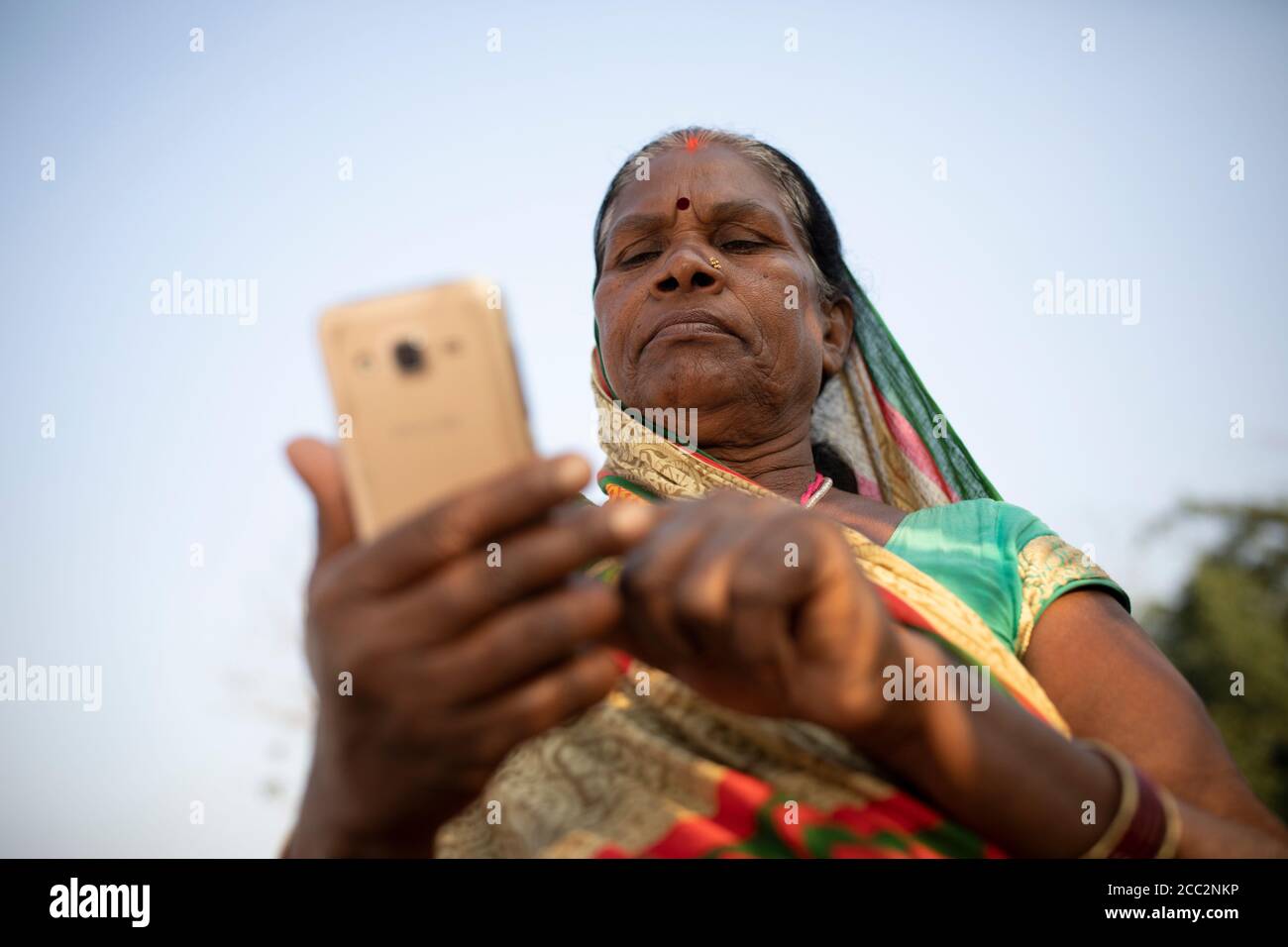 Villager cell phone hi-res stock photography and images - Alamy