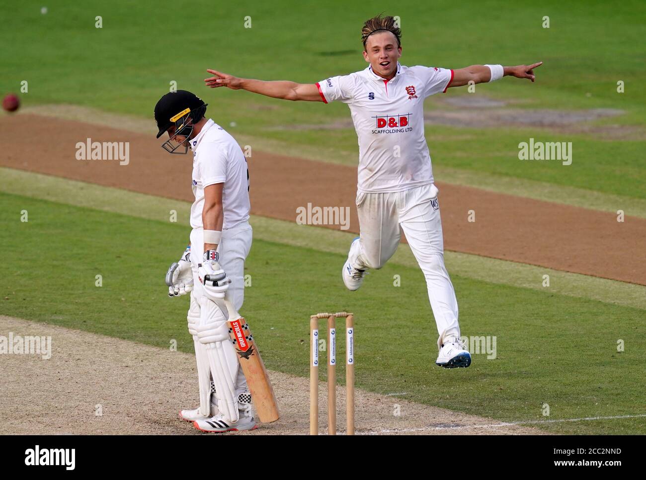 Essex's Aaron Beard (right) celebrates taking the wicket of Sussex's ...