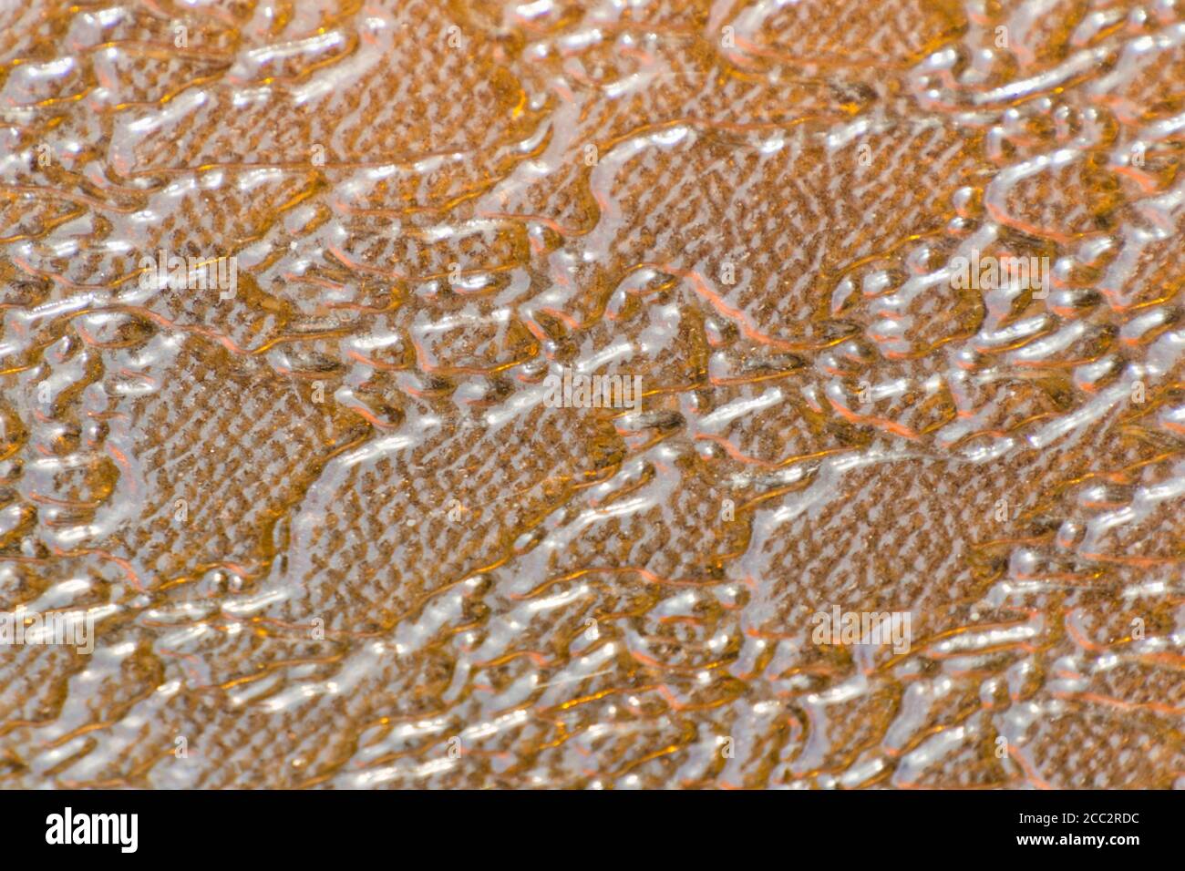 Patterned glass, close-up. Orange color Stock Photo - Alamy