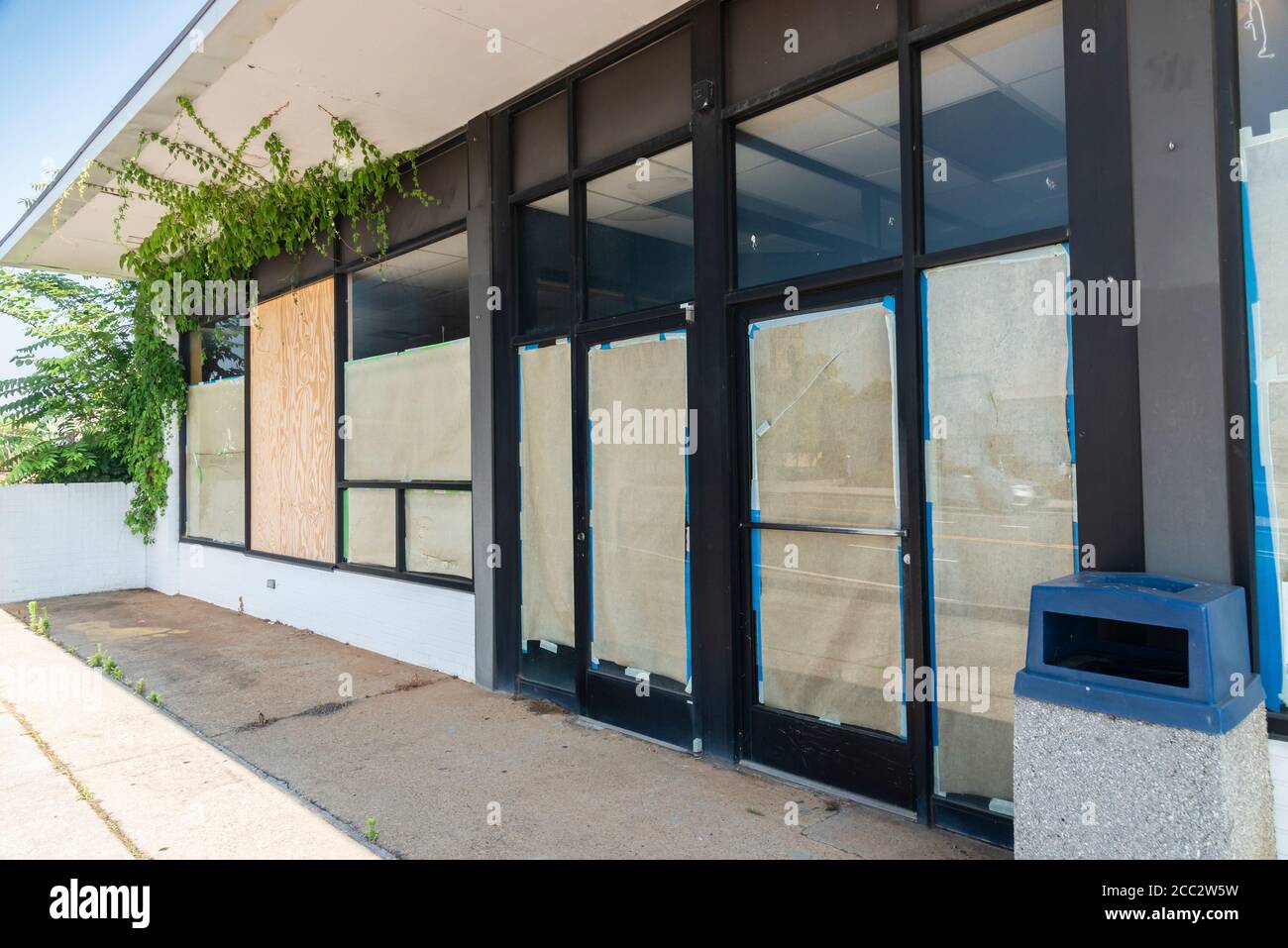 Horizontal shot of a retail store that went out of business due to the ...
